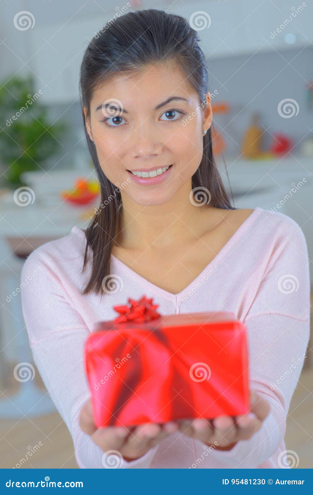 Studio Shot Young Eurasian Woman Offering Gift Stock Photo - Image of ...