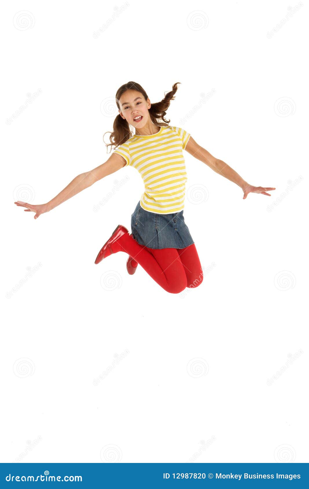 Studio Shot of Young Girl Jumping in Air Stock Photo - Image of natural ...
