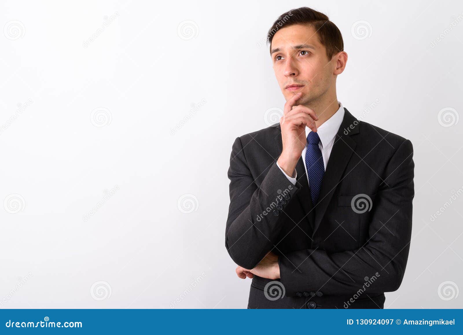 Studio Shot of Young Handsome Businessman Thinking while Looking Stock ...