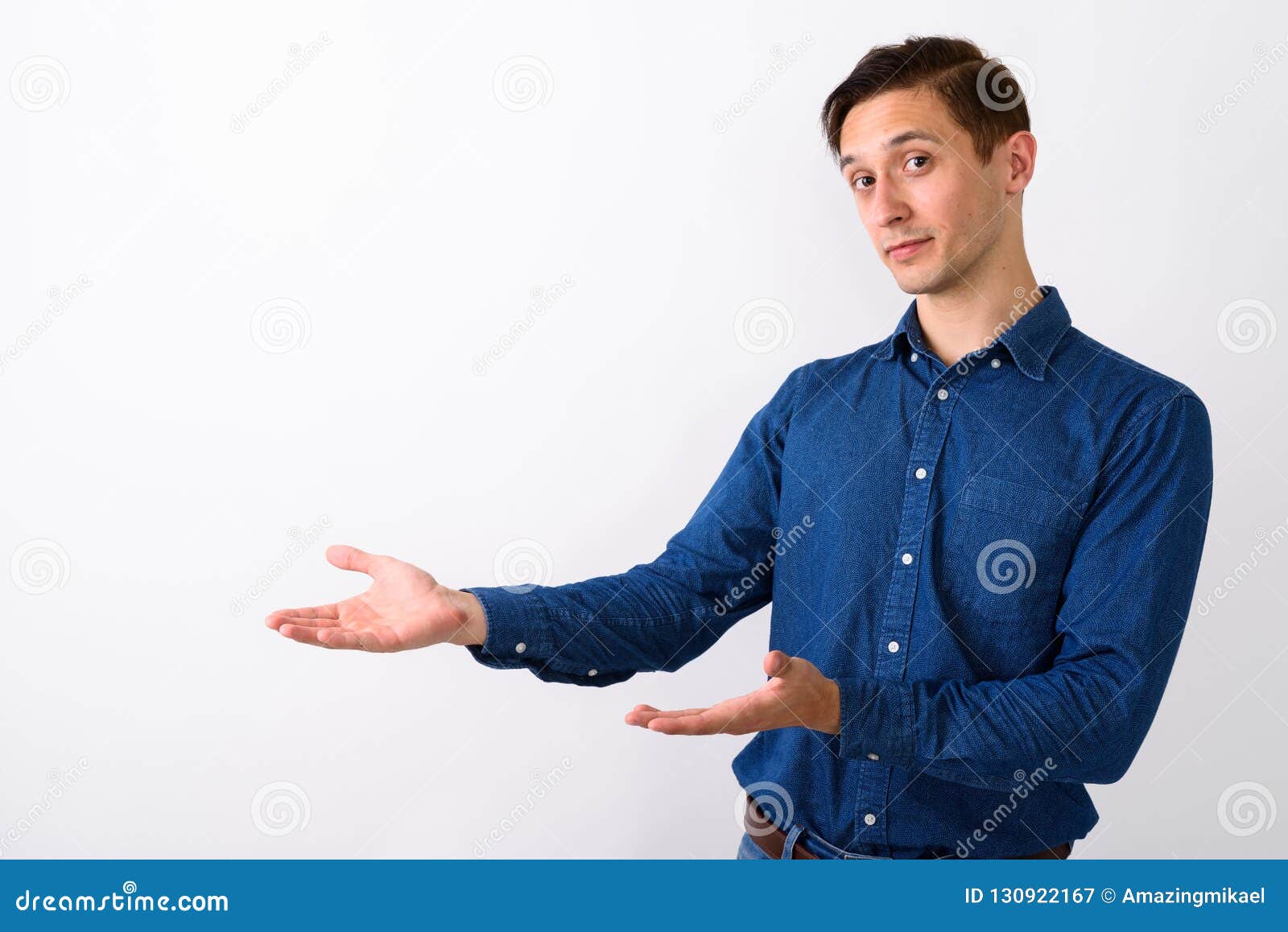 Studio Shot of Young Handsome Man Against Showing Something Whit Stock ...