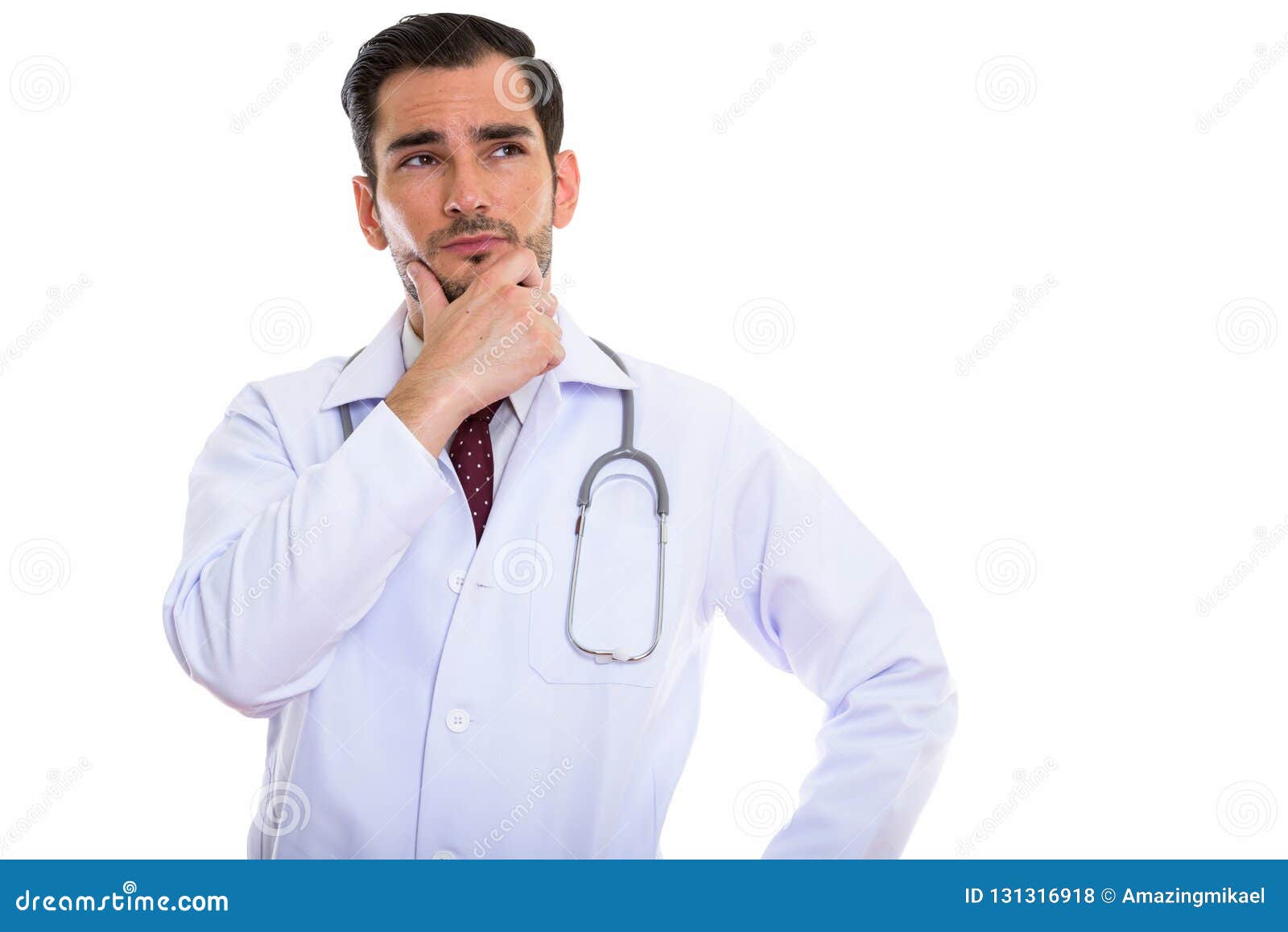 Studio Shot of Young Handsome Man Doctor Thinking while Looking Stock ...