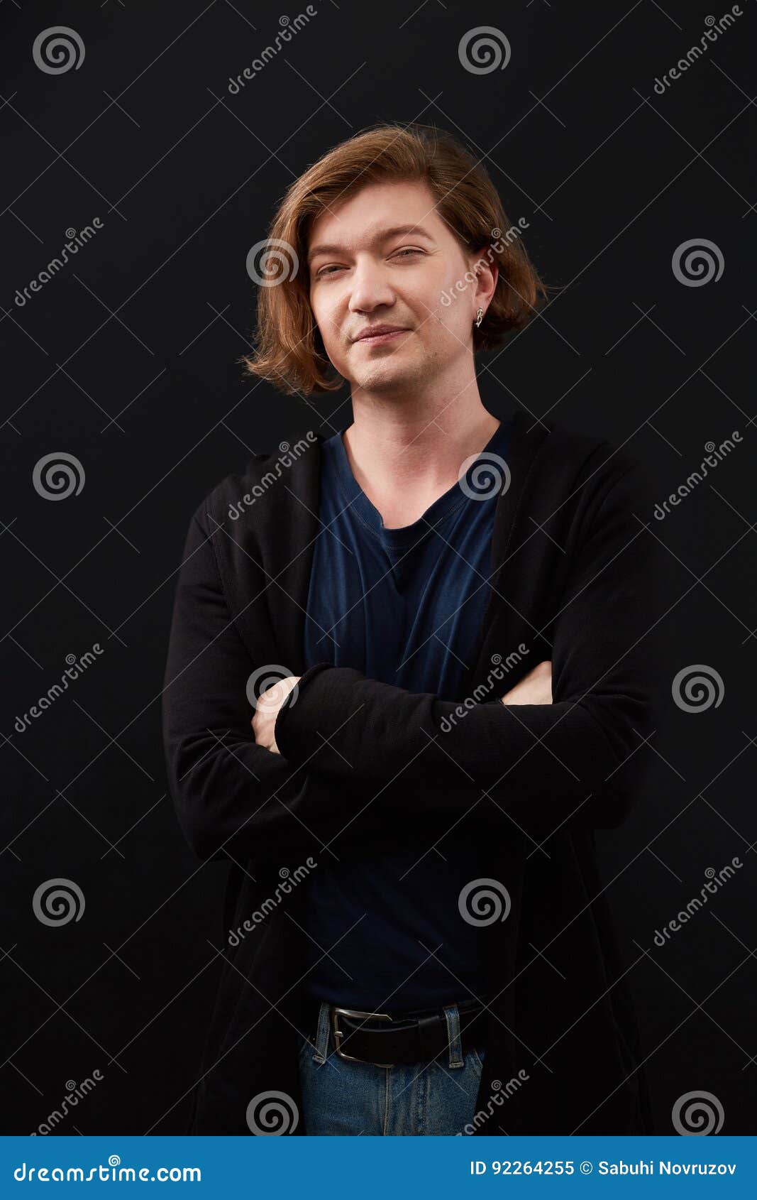 Studio Shot of Young Handsome Man with Ironic Smile. Stock Image ...