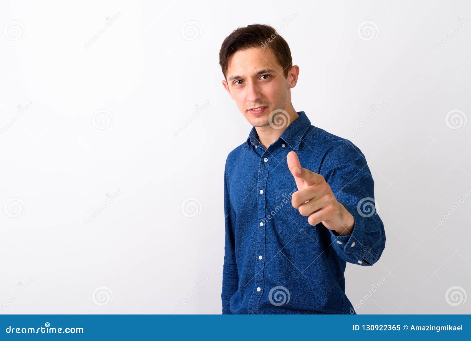 Studio Shot of Young Handsome Man Pointing at Camera Against Whi Stock ...