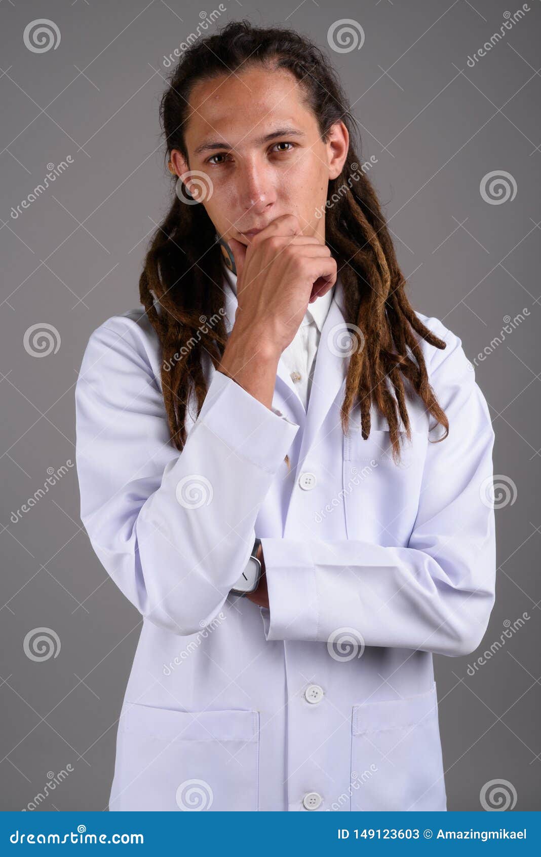 Young Man Doctor with Dreadlocks Against Gray Background Stock Image ...