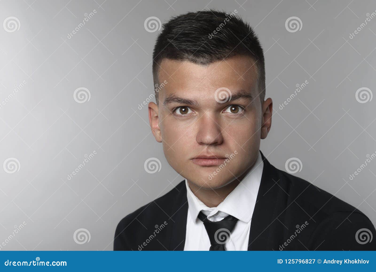 Studio Shot of Young Man Looking at the Camera. Stock Image - Image of ...