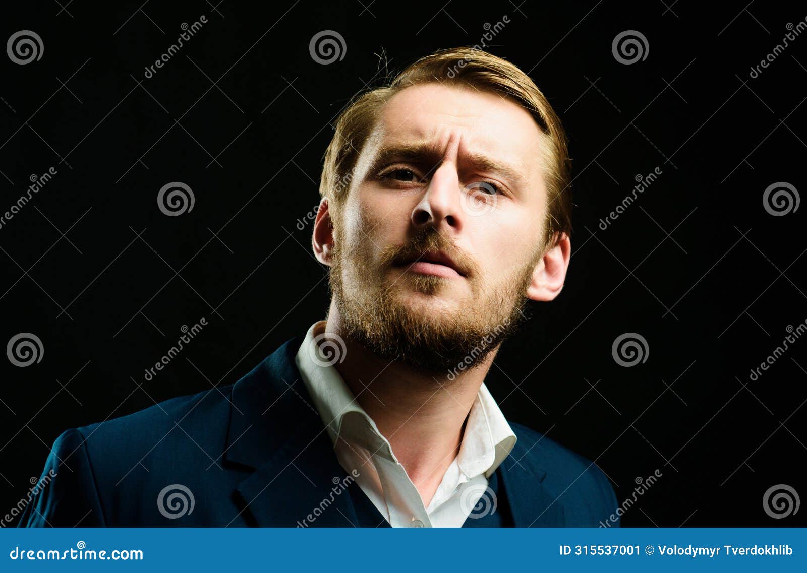 Studio Shot of Young Man Looking at the Camera. Handsome Guy with ...