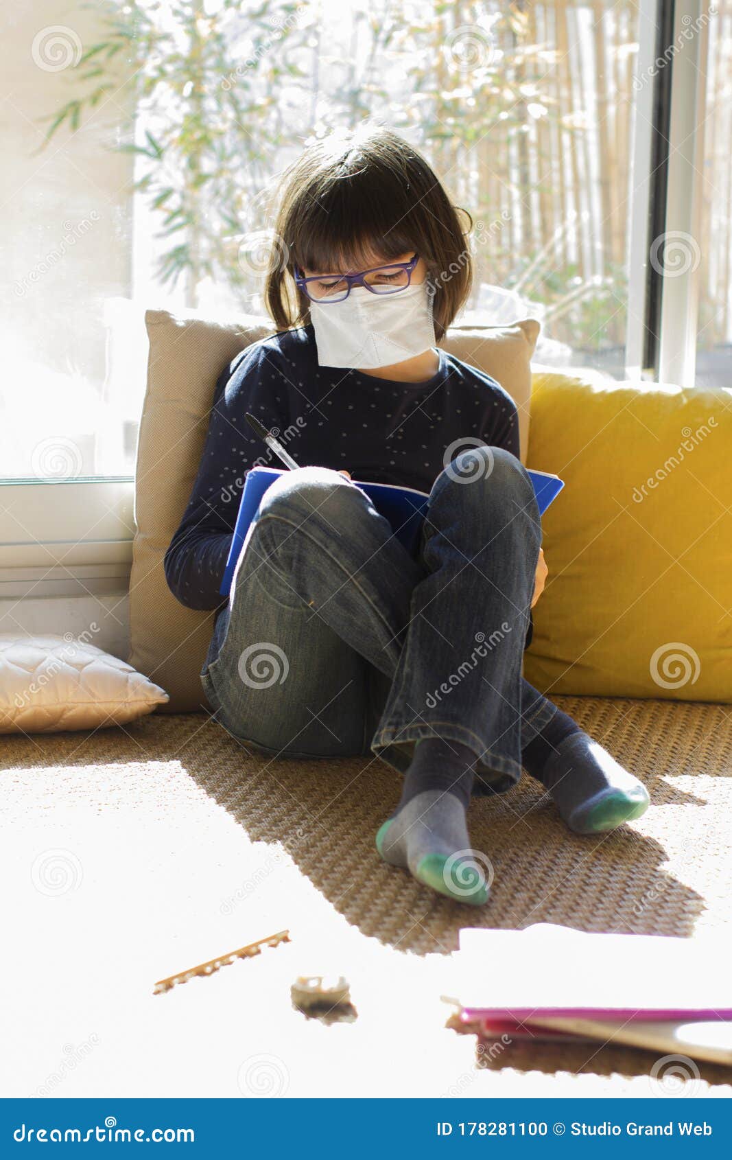 Studious Lockdown Kid with Face Mask Writing while School Shutdown ...