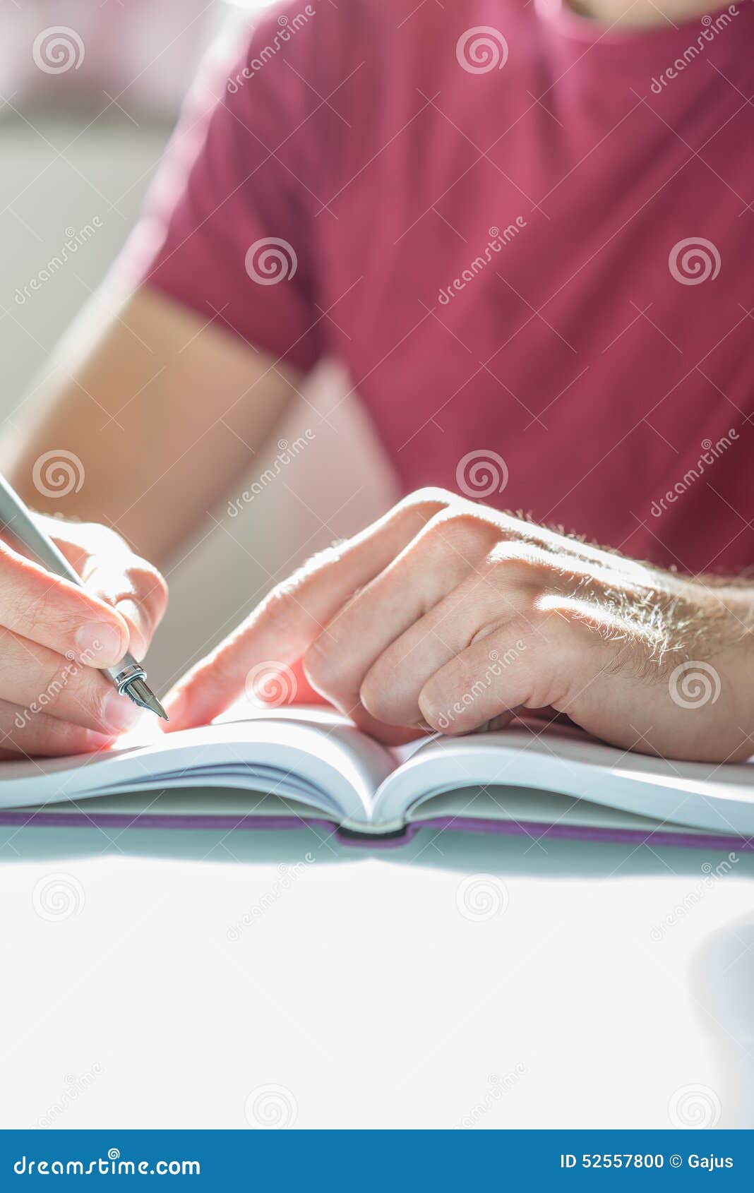Studious Man Writing On His Notebook On The Table. Stock Photography ...