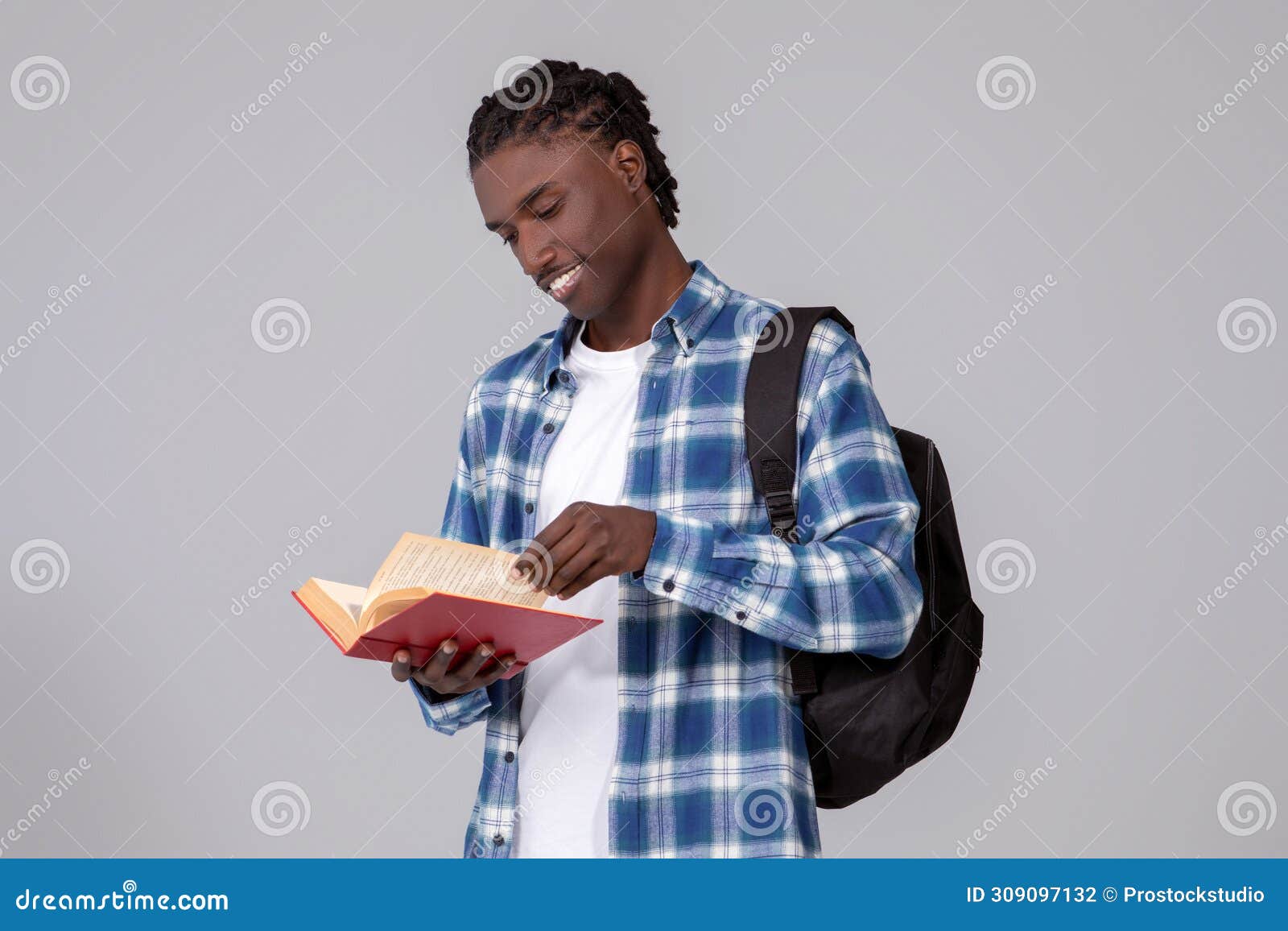 Study Concept. Smiling Young Black Student Guy with Book and Backpack ...
