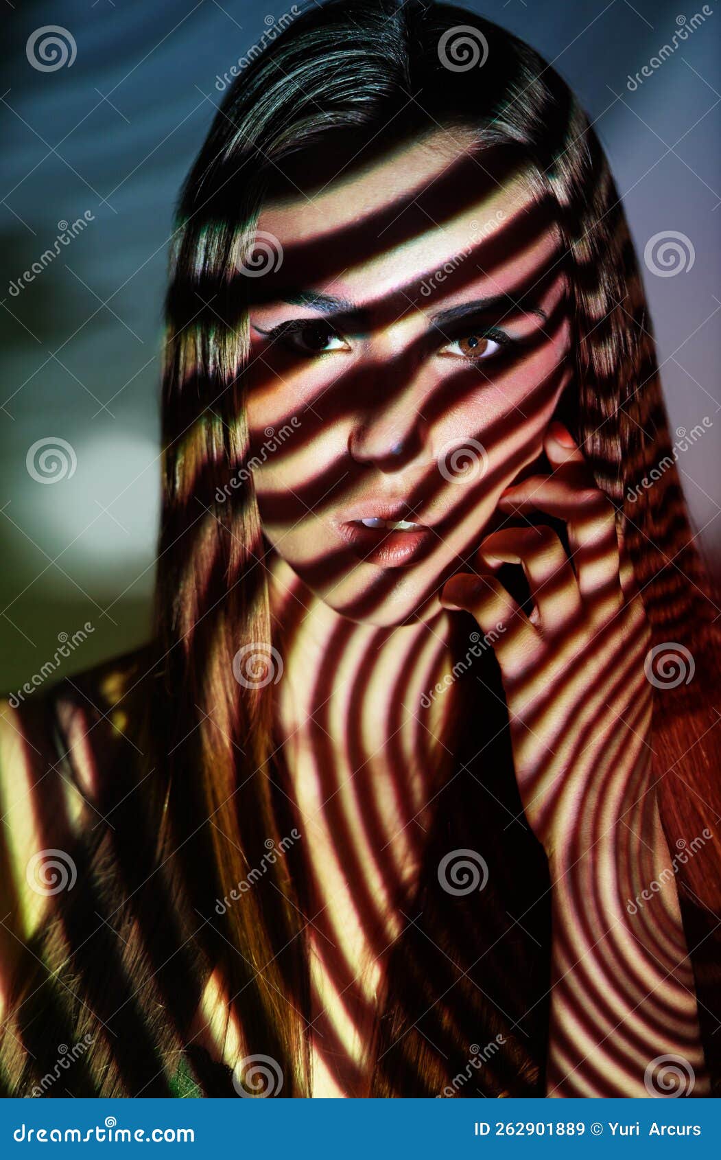 Study of Light and Beauty. Studio Shot of a Young Woman with Projected ...