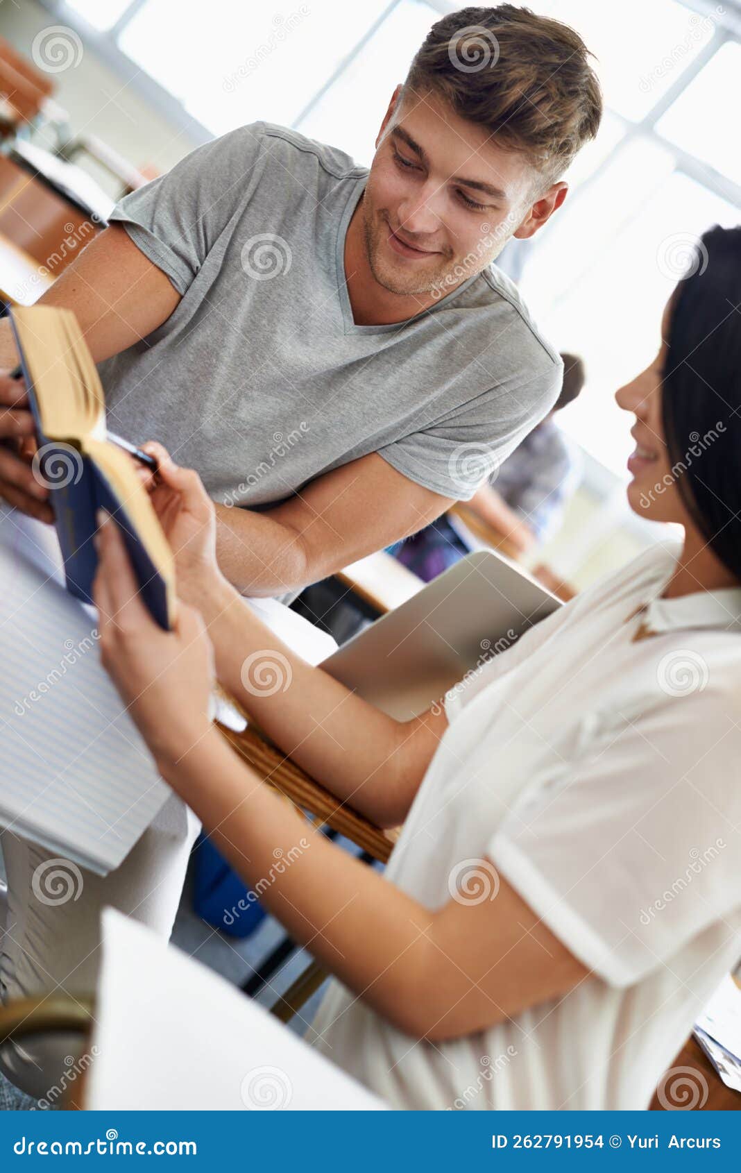 Study Partners. a Young Male and Female Student Studying in a Classroom ...