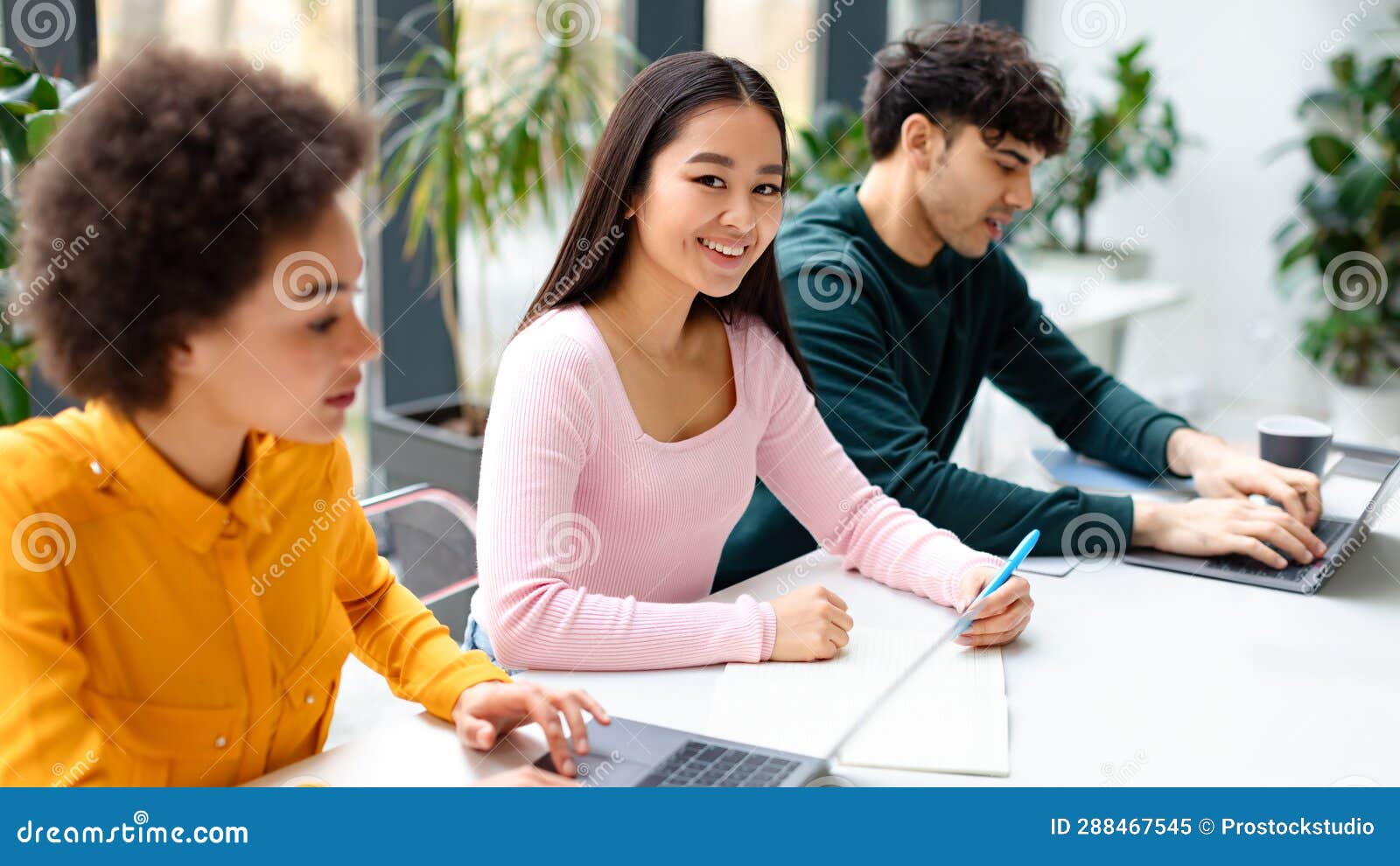 Study Process. Diverse Classmates Sitting at Desk, Asian Lady Smiling ...