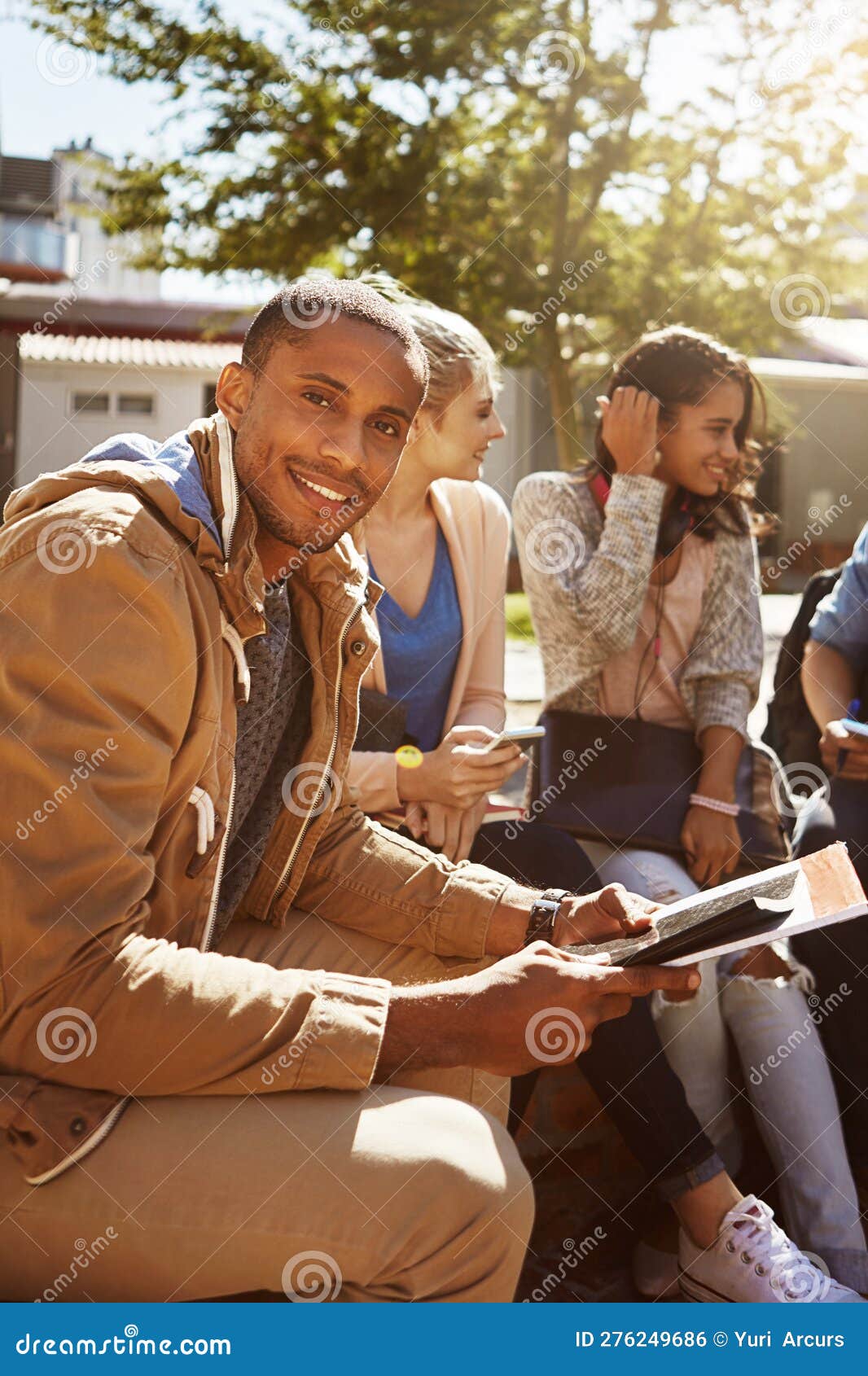Studying is Actually Pretty Fun. Portrait of a Student Studying Outside ...
