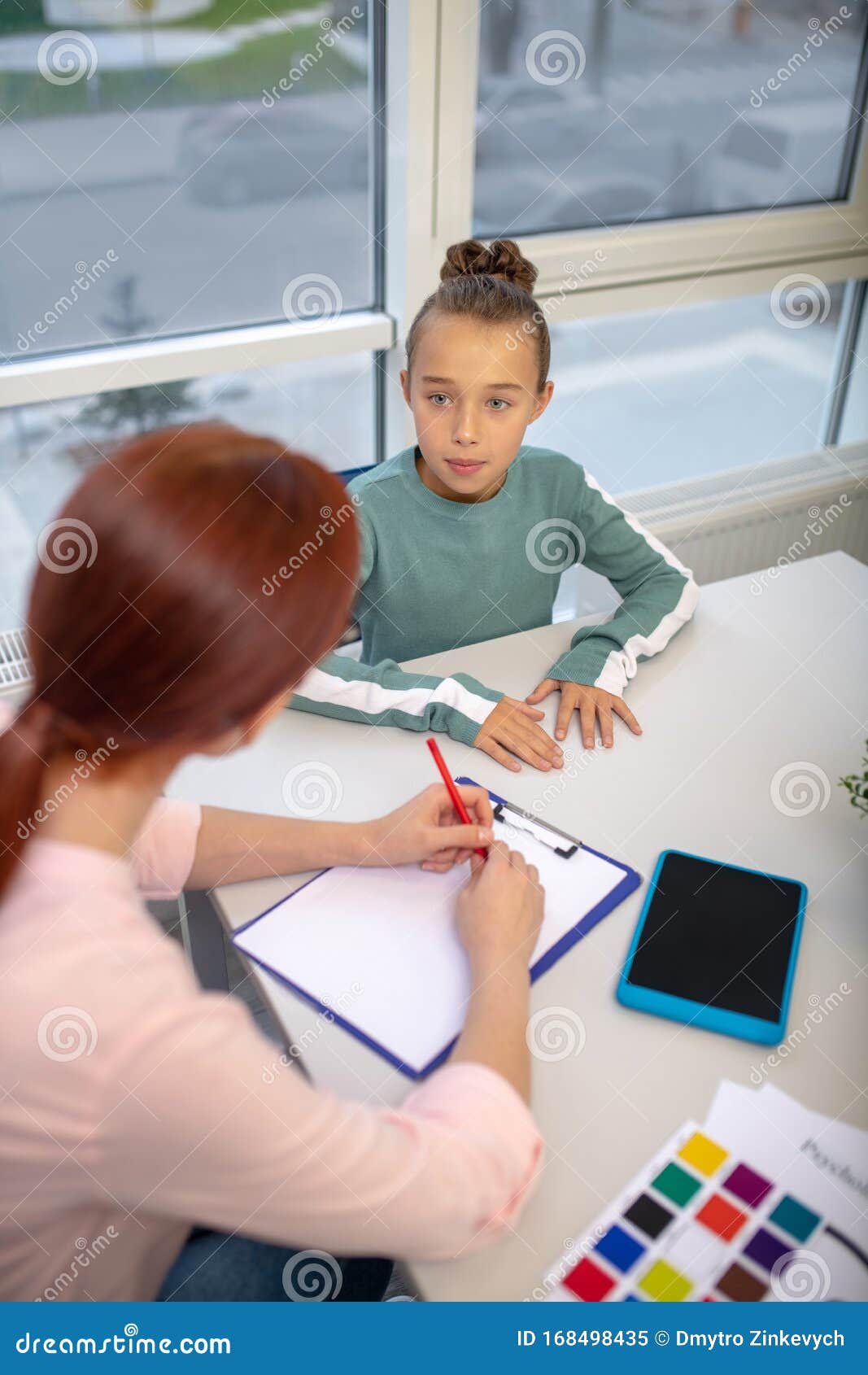 Teacher Working with Her Young Student during the Individual Lesson ...