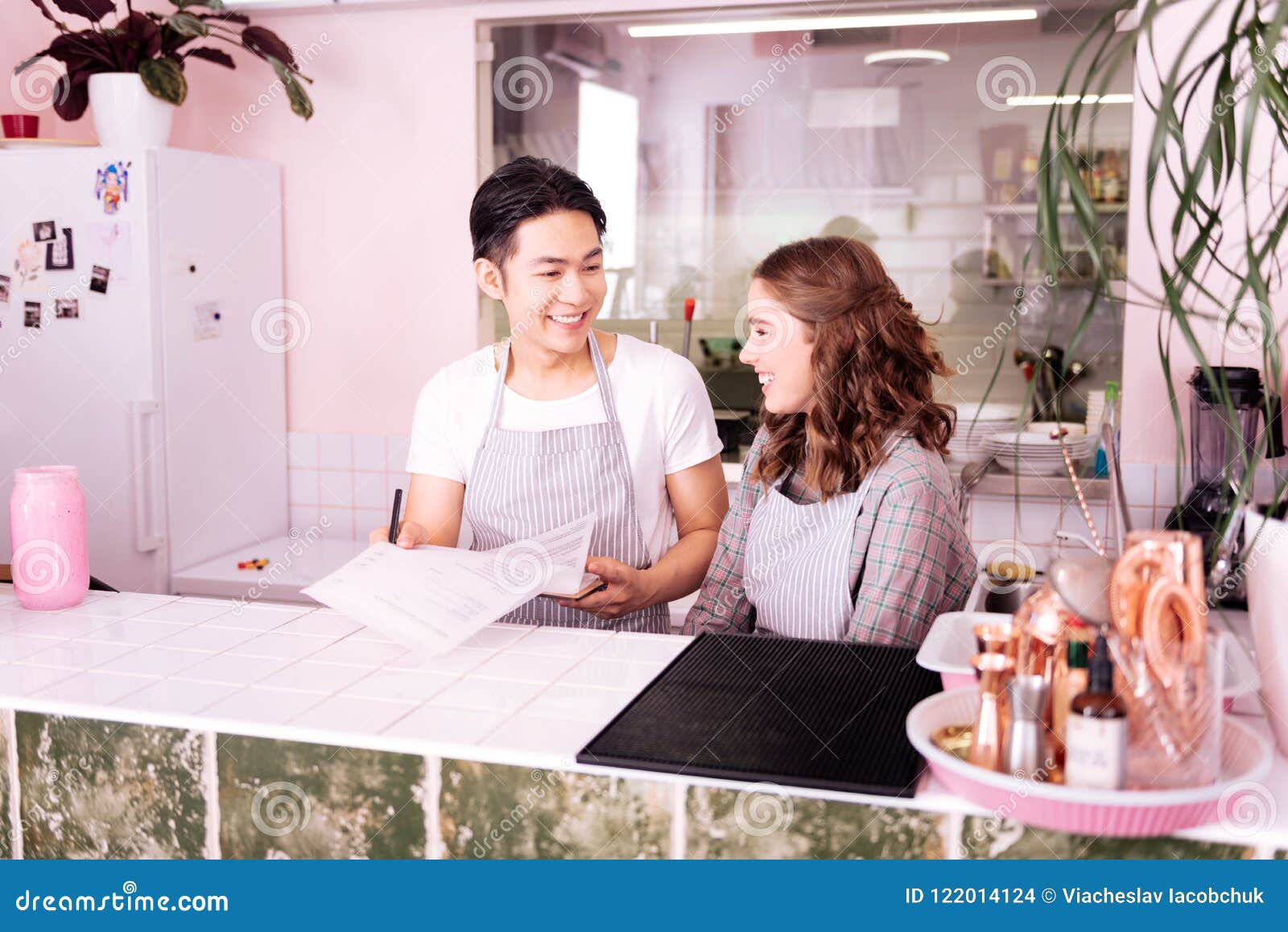 Two Waiters Enjoying the Process of Studying Menu Stock Photo - Image ...