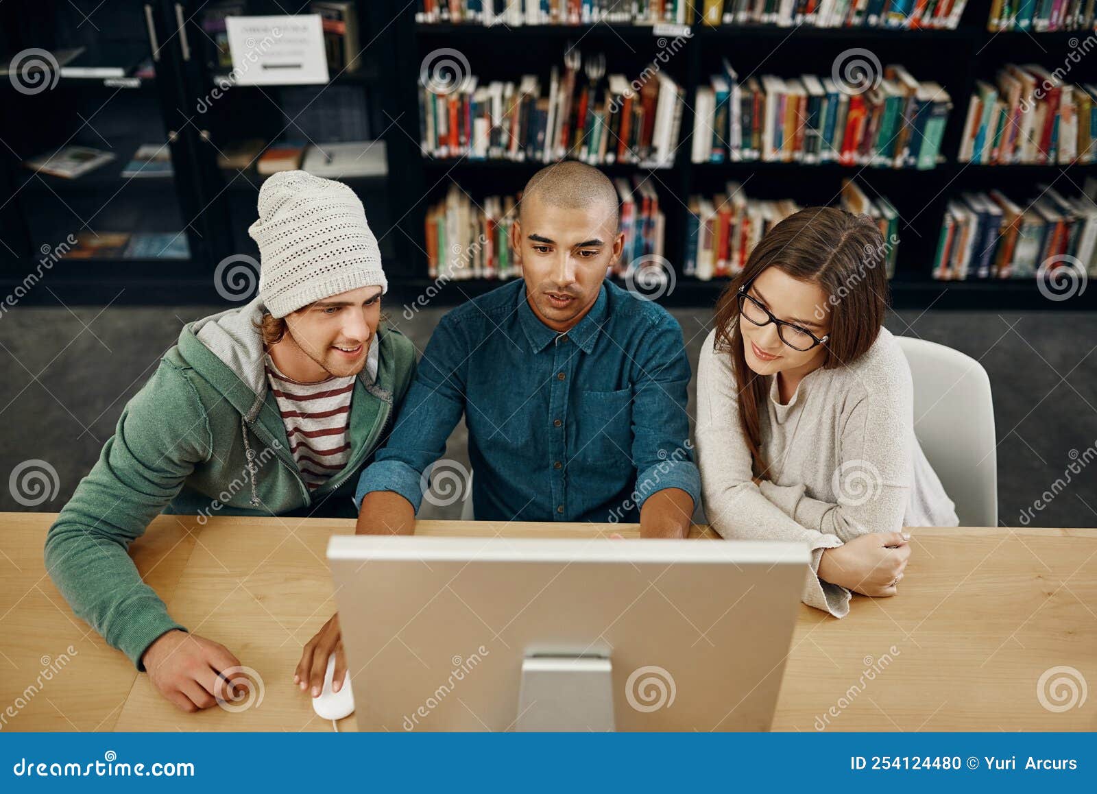 Studying Together. High Angle Shot of Three Young University Students ...