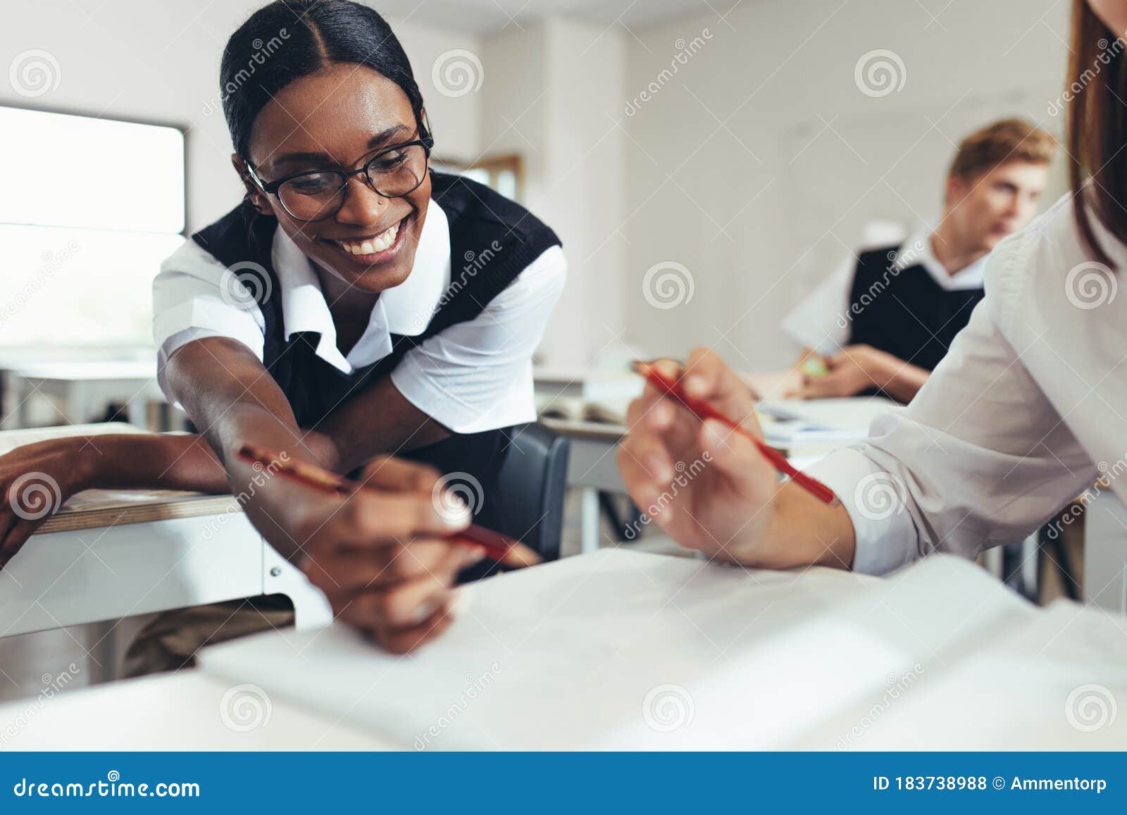 Studying Together in School Stock Photo - Image of studying, talking ...