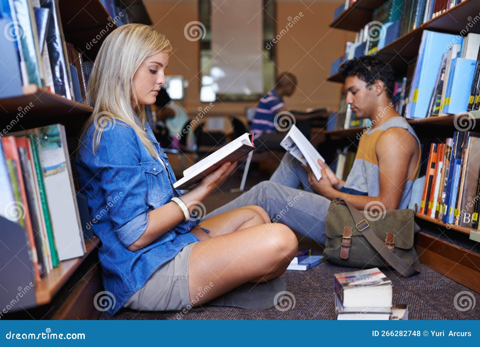 Studying Wherever they Find a Quiet Spot. Two Students Reading Separate ...