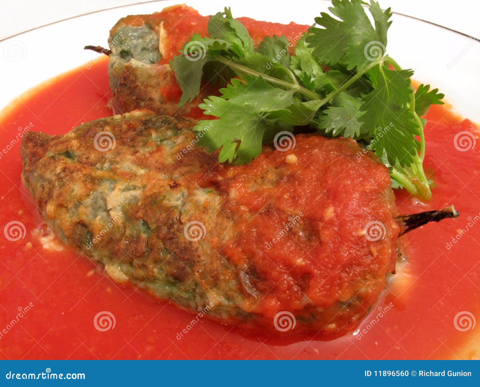 Stuffed Chili Peppers in Tomato Sauce Stock Photo - Image of meal ...