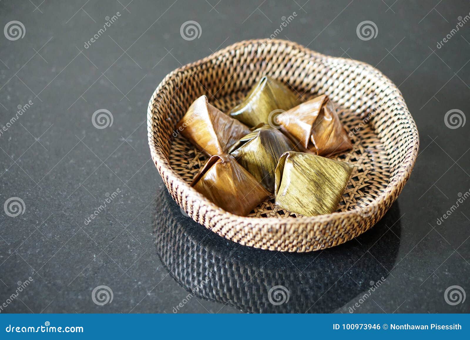 Stuffed Dough Pyramid Dessert on Bamboo Pattern Stock Photo - Image of ...