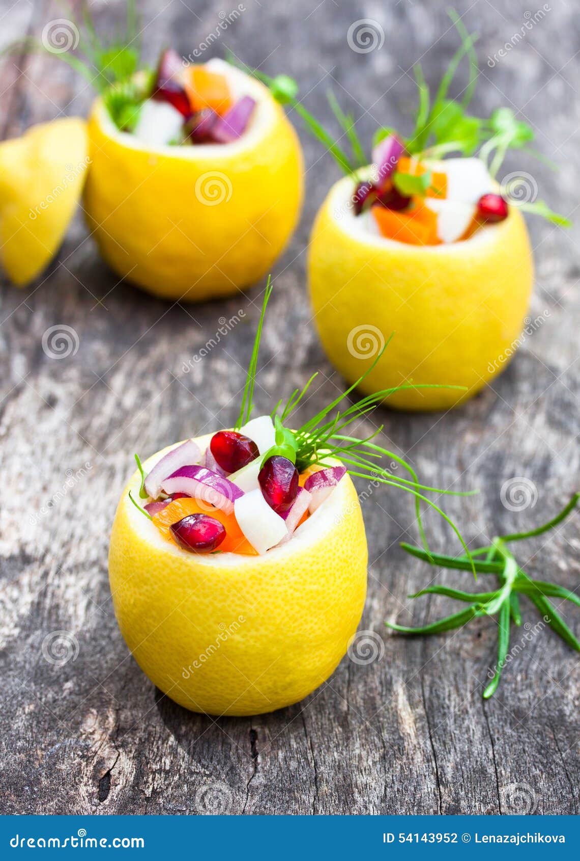Stuffed Lemons with Vegetarian Salad on the Old Table Stock Photo ...
