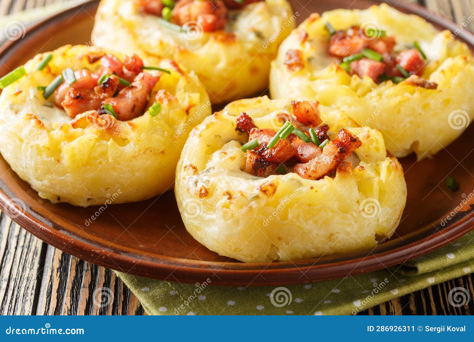 Stuffed Mashed Potato Nests Filled with Bacon and Onion Close-up in a ...