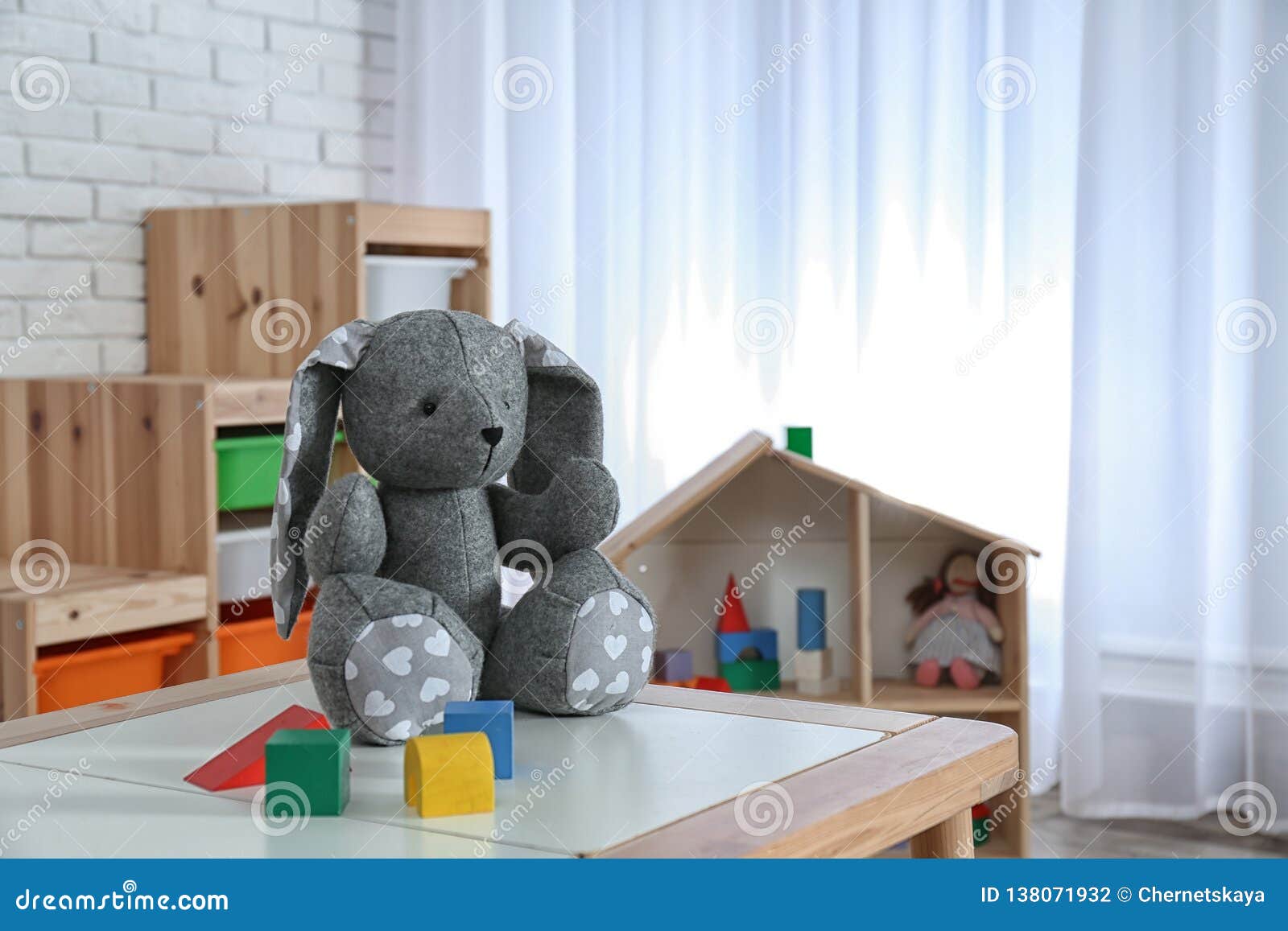 Stuffed rabbit on table stock photo. Image of design - 138071932