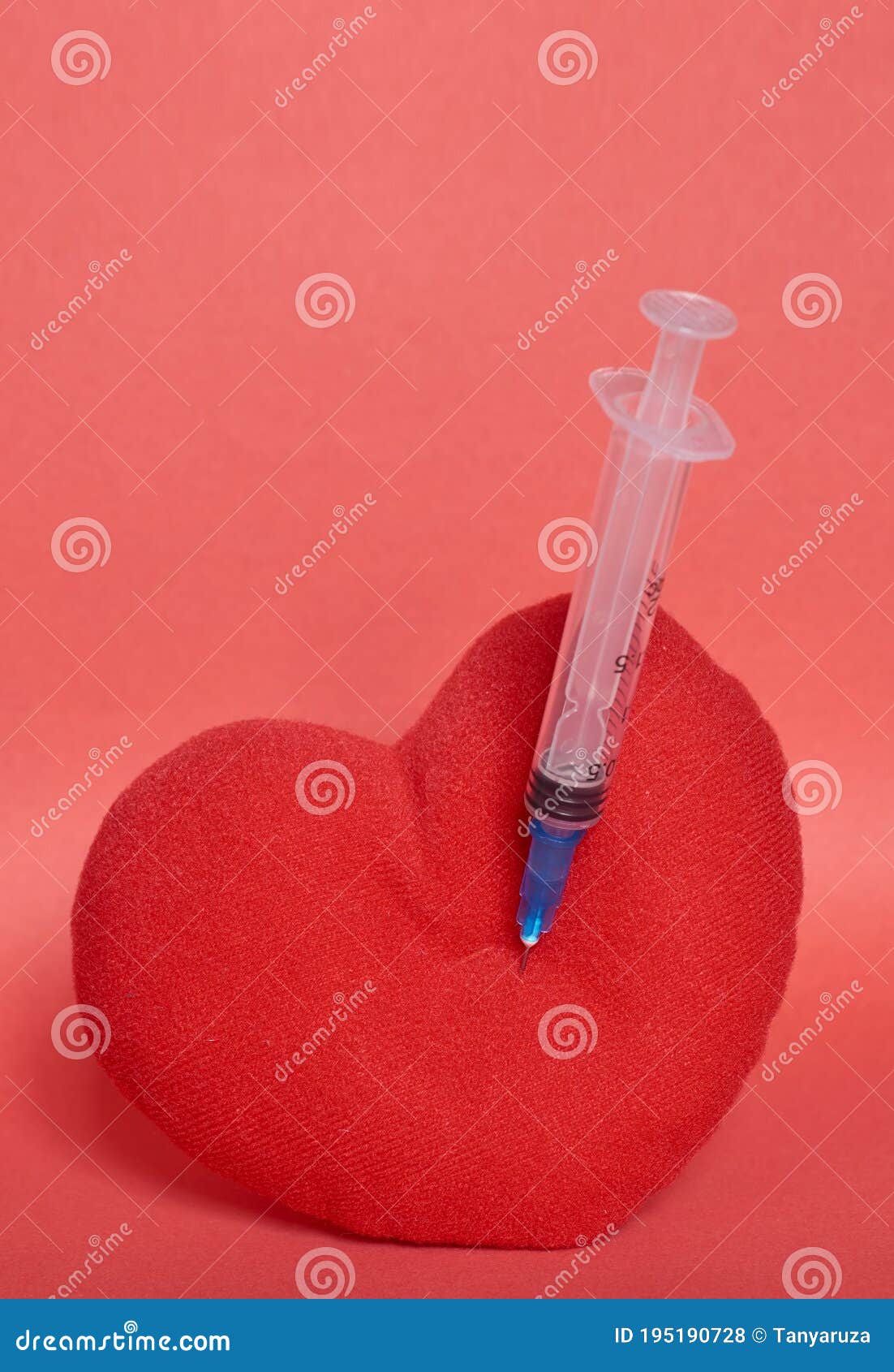 A Stuffed Toy Heart with a Syringe Stuck in it Stock Photo - Image of ...