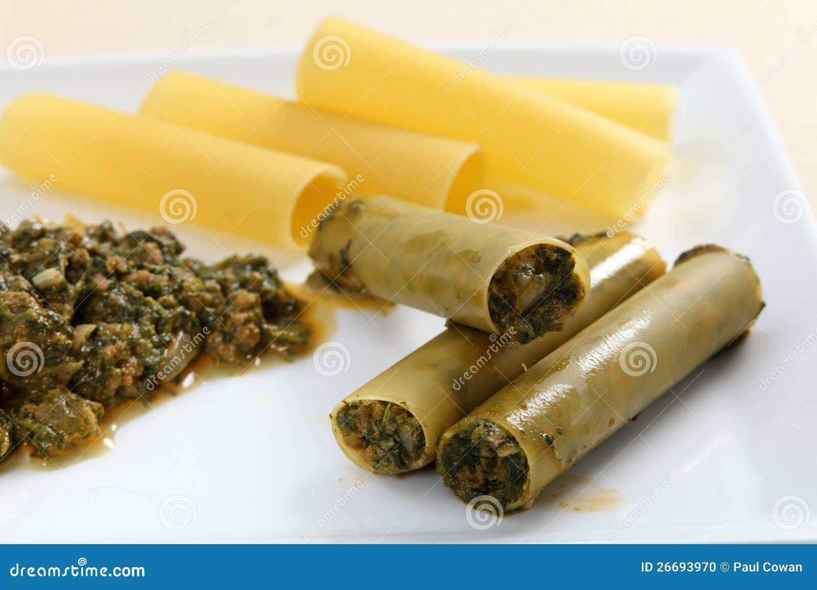 Stuffing cannelloni tubes stock photo. Image of cooking - 26693970