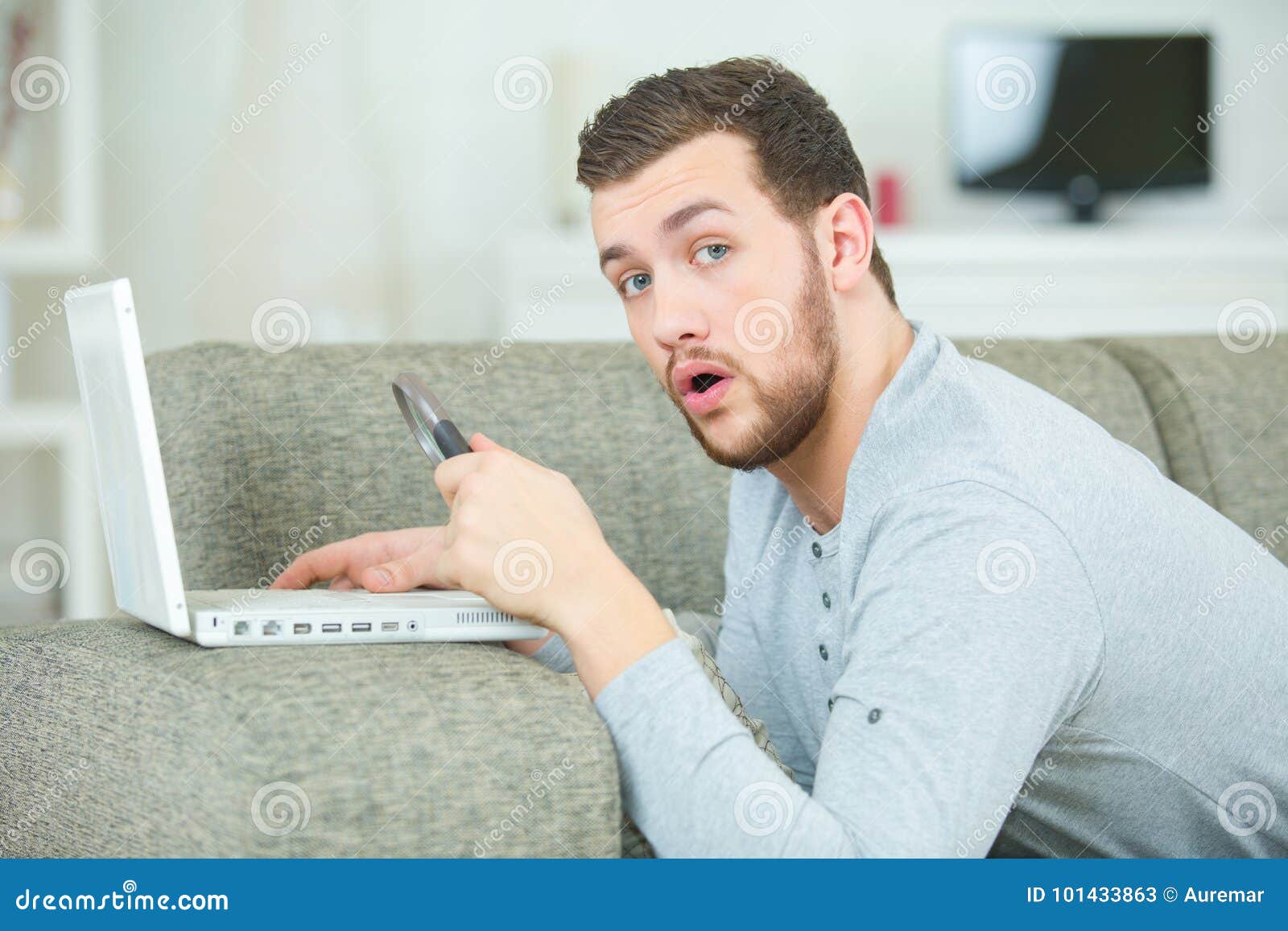 Stunned man on computer stock image. Image of company - 101433863