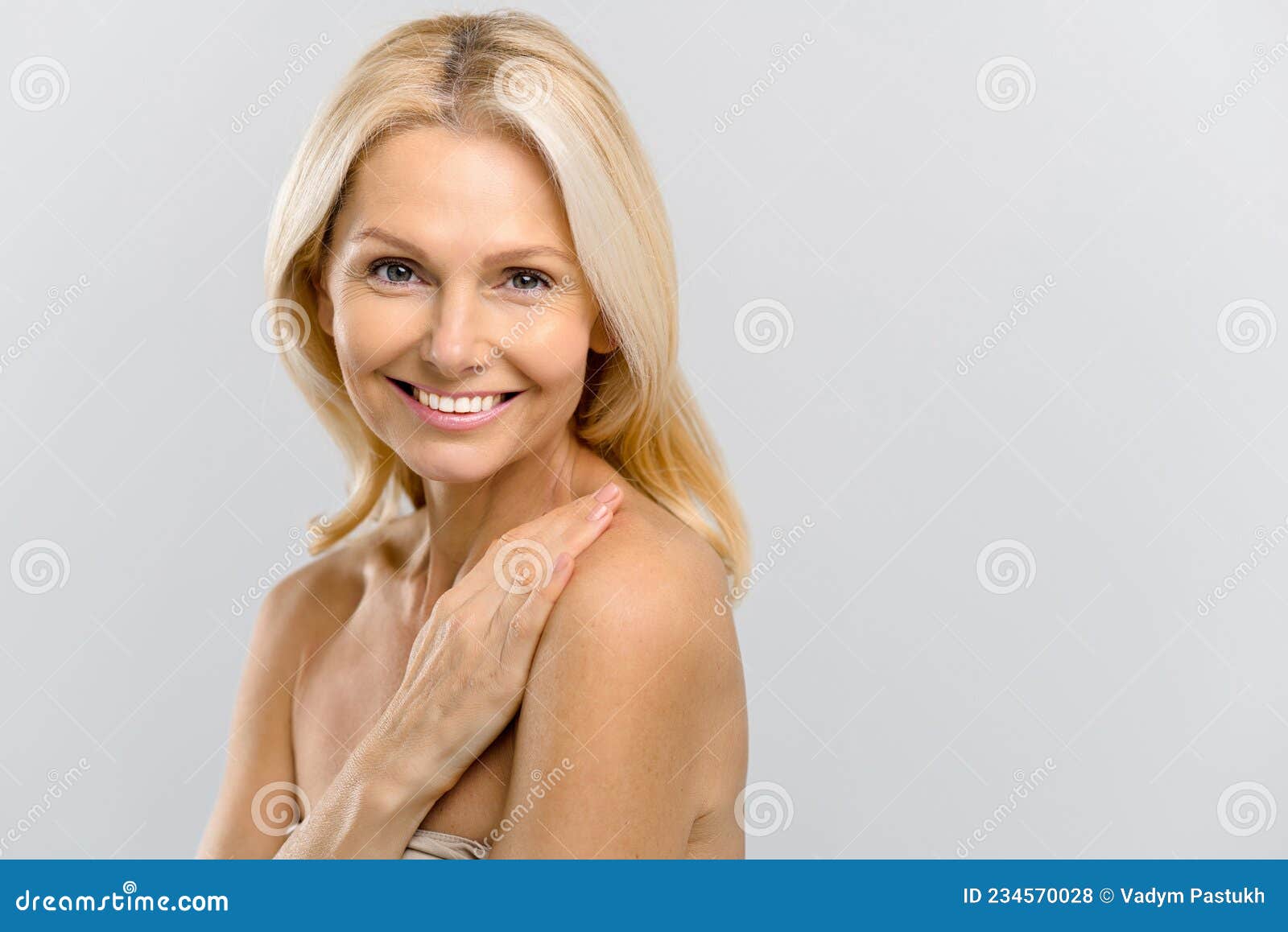 Stunning Attractive Middle Aged Blonde Woman Look At The Camera Over