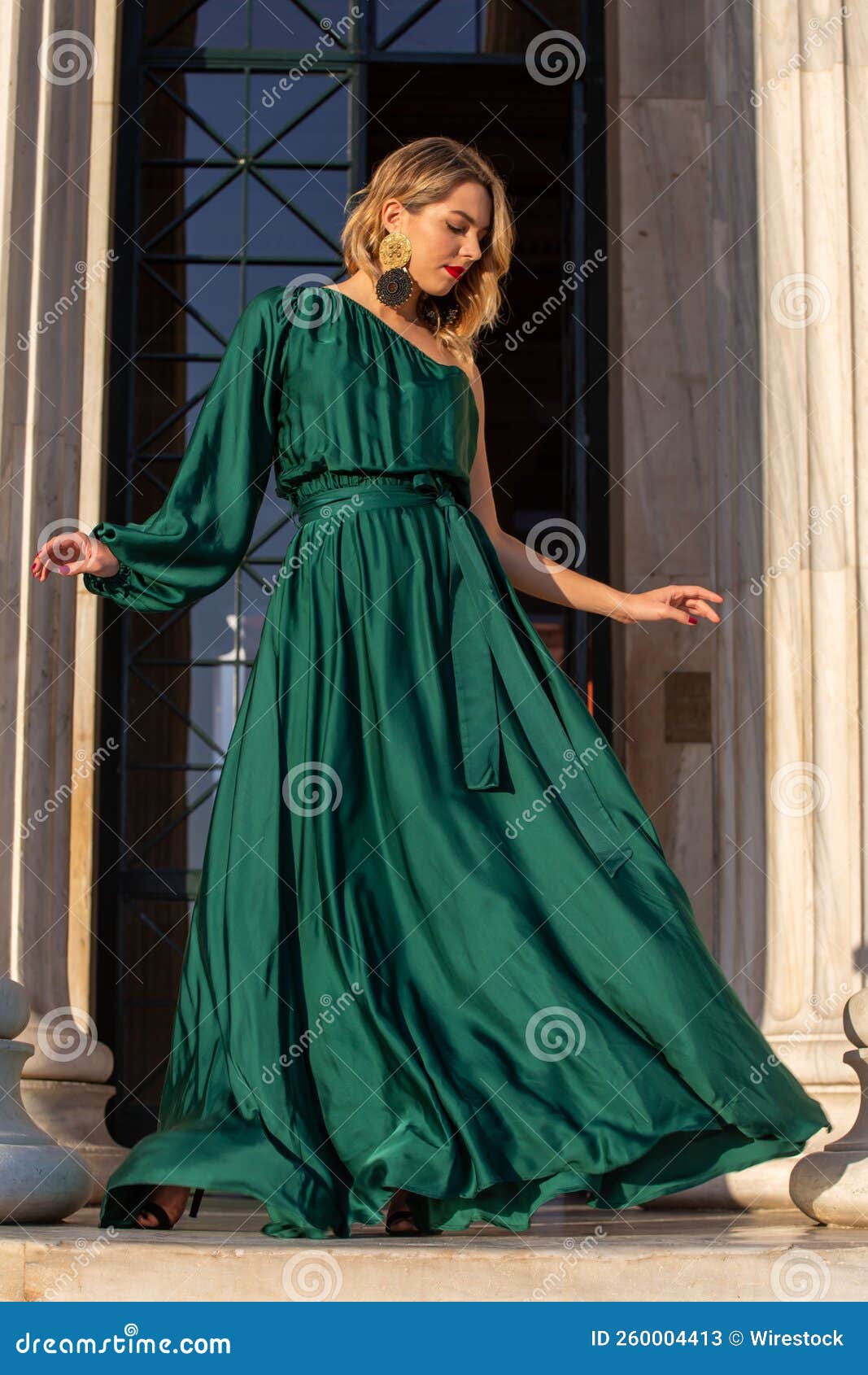 Stunning Beautiful Young Model Posing Outside While Wearing Long Green