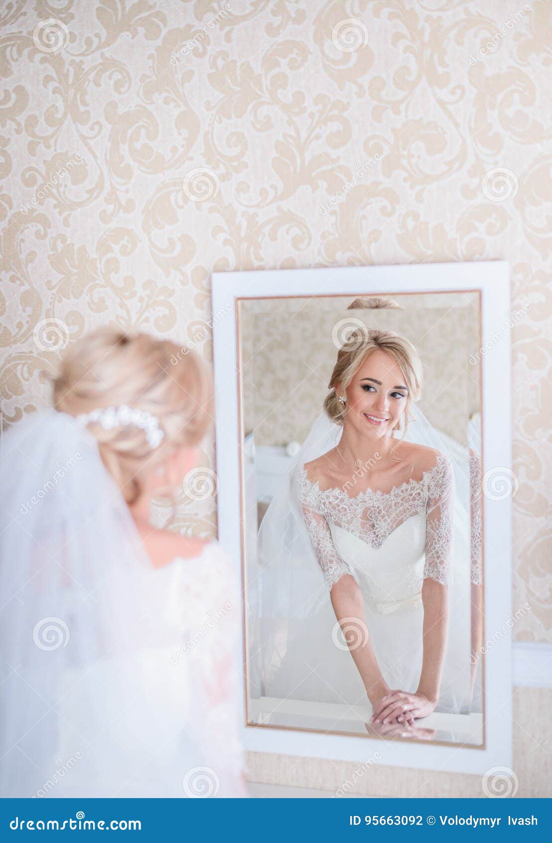Stunning Blonde Bride Looks in White Mirror Stock Photo - Image of ...