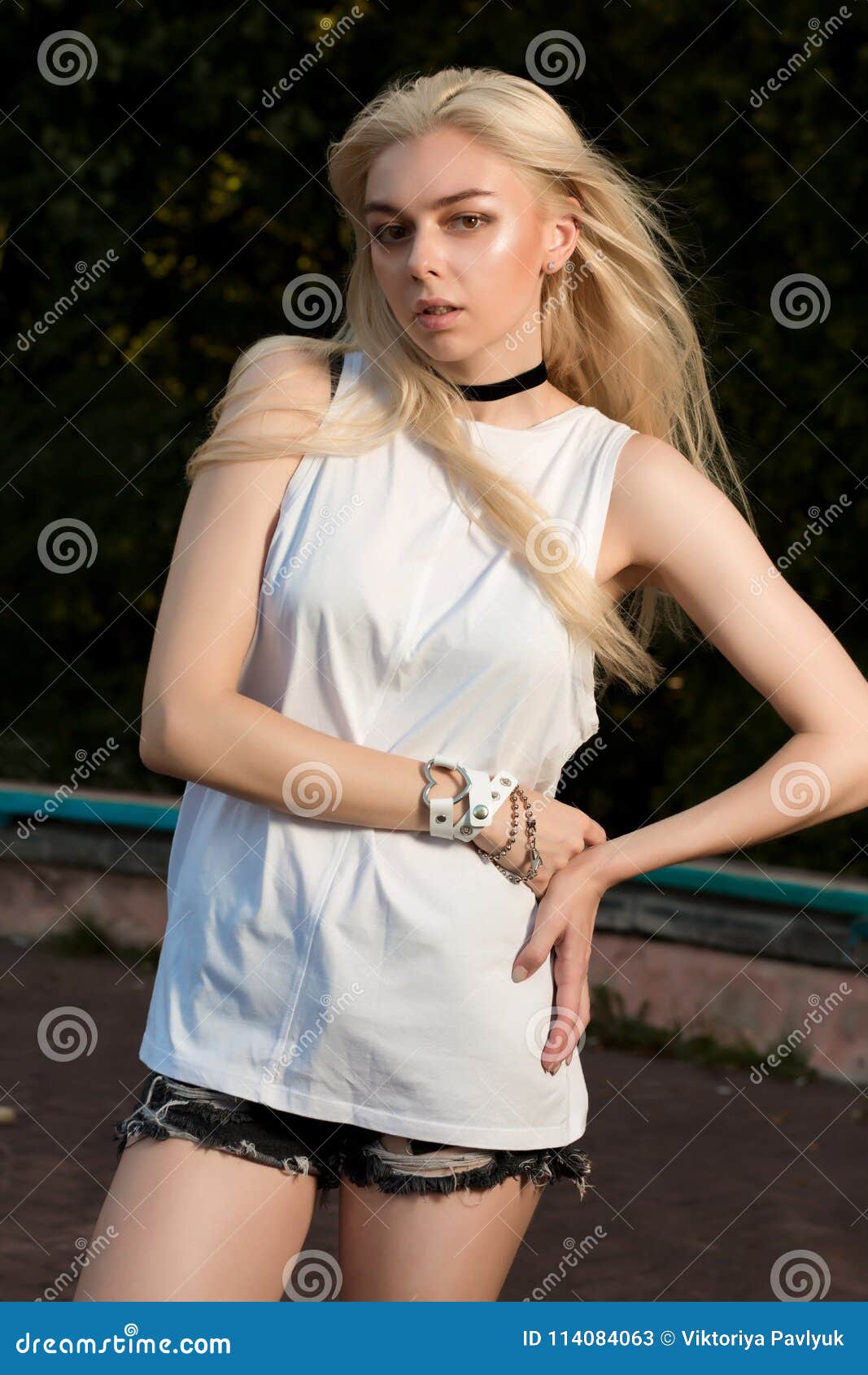 Stunning Blonde Girl With Long Hair Dressed In Fashionable Cloth Stock