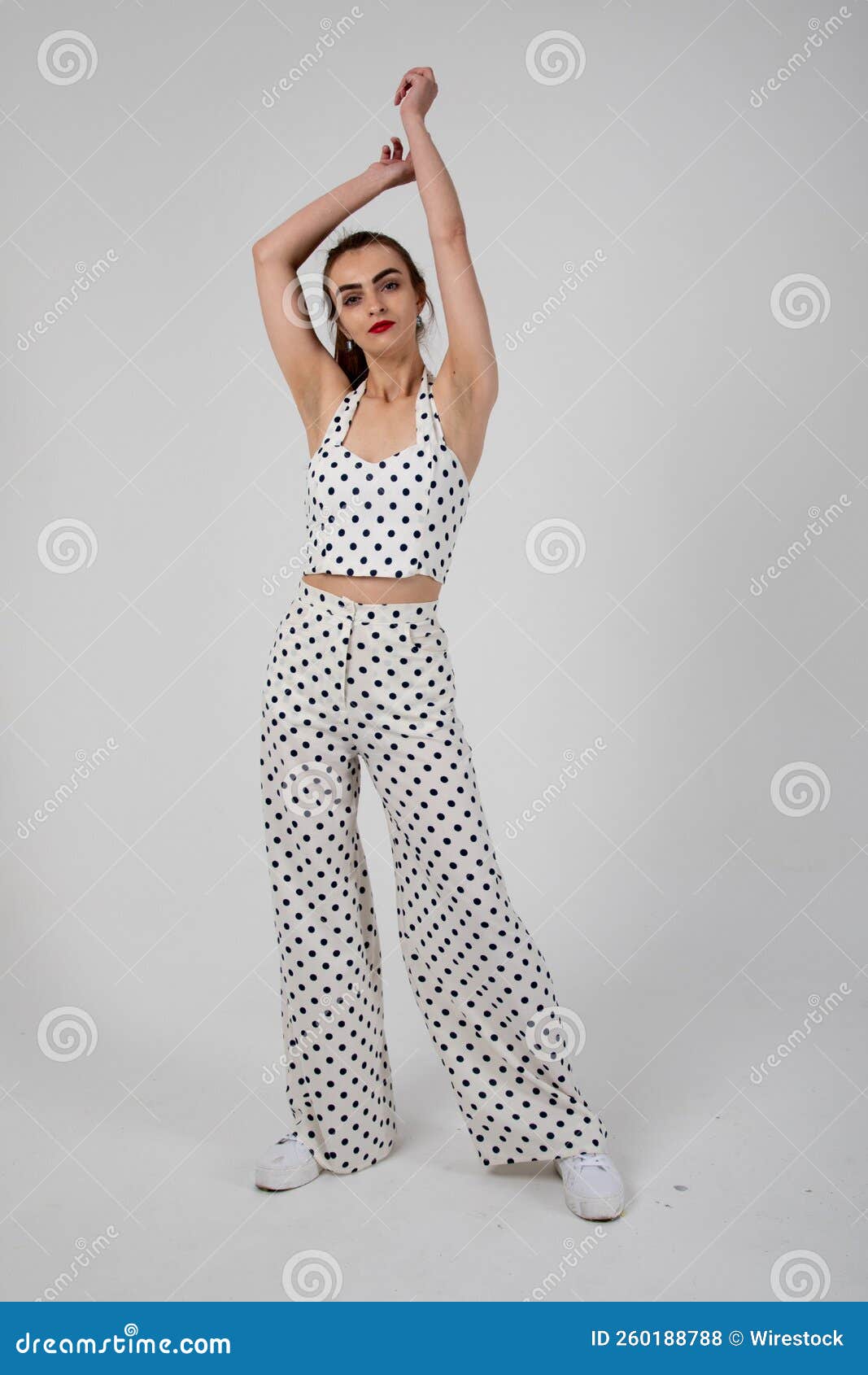 Stunning Model Posing in a White Polka Dot Set Stock Photo - Image of ...