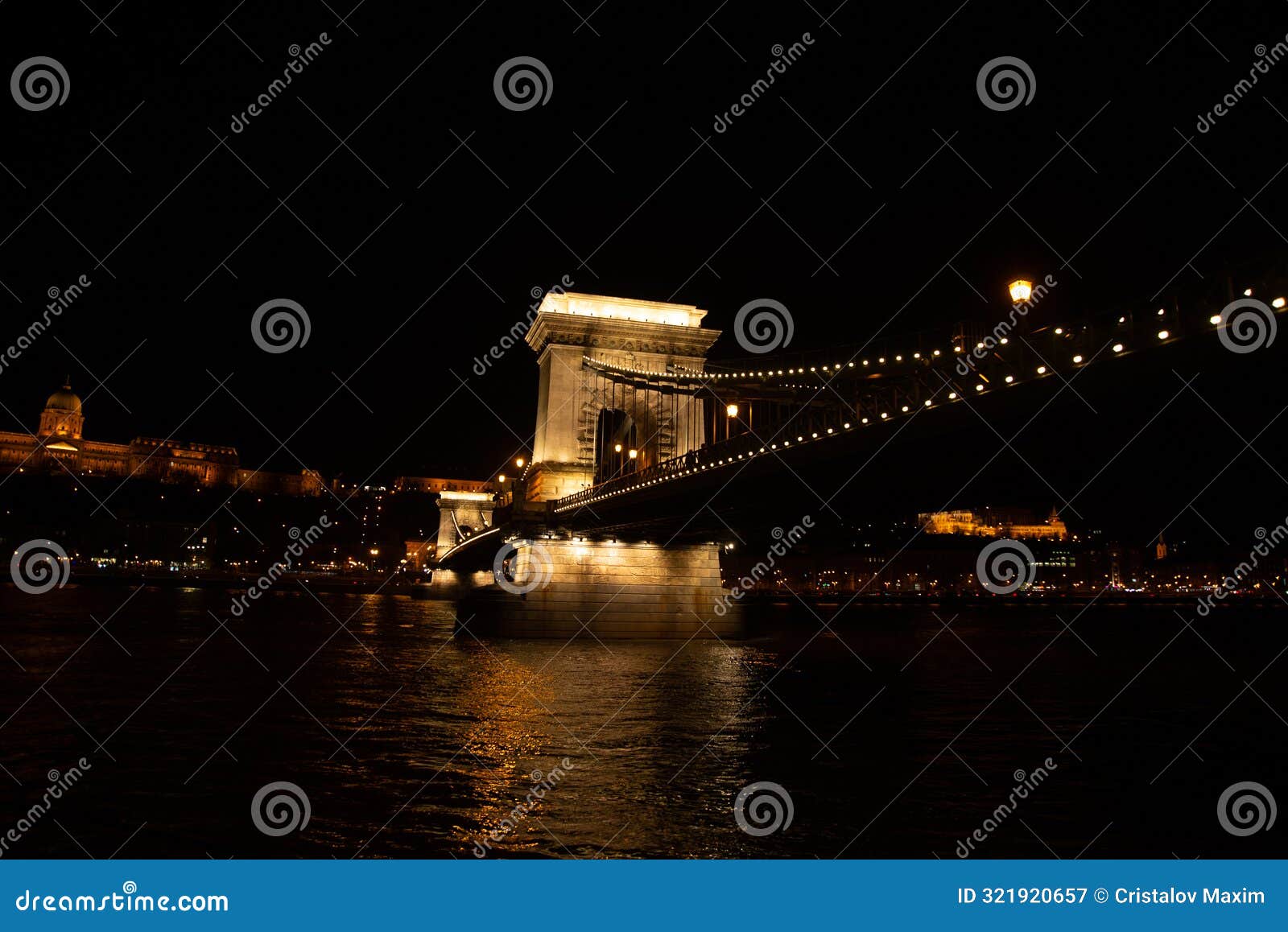 A Stunning Night View of an Illuminated Bridge Casting Its Reflection ...