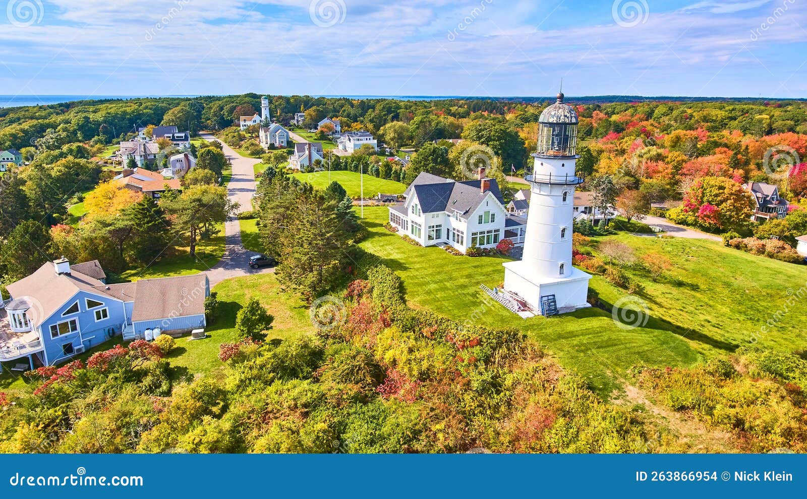 Stunning Pair of Lighthouses in Fall Forest with Homes Surrounding ...