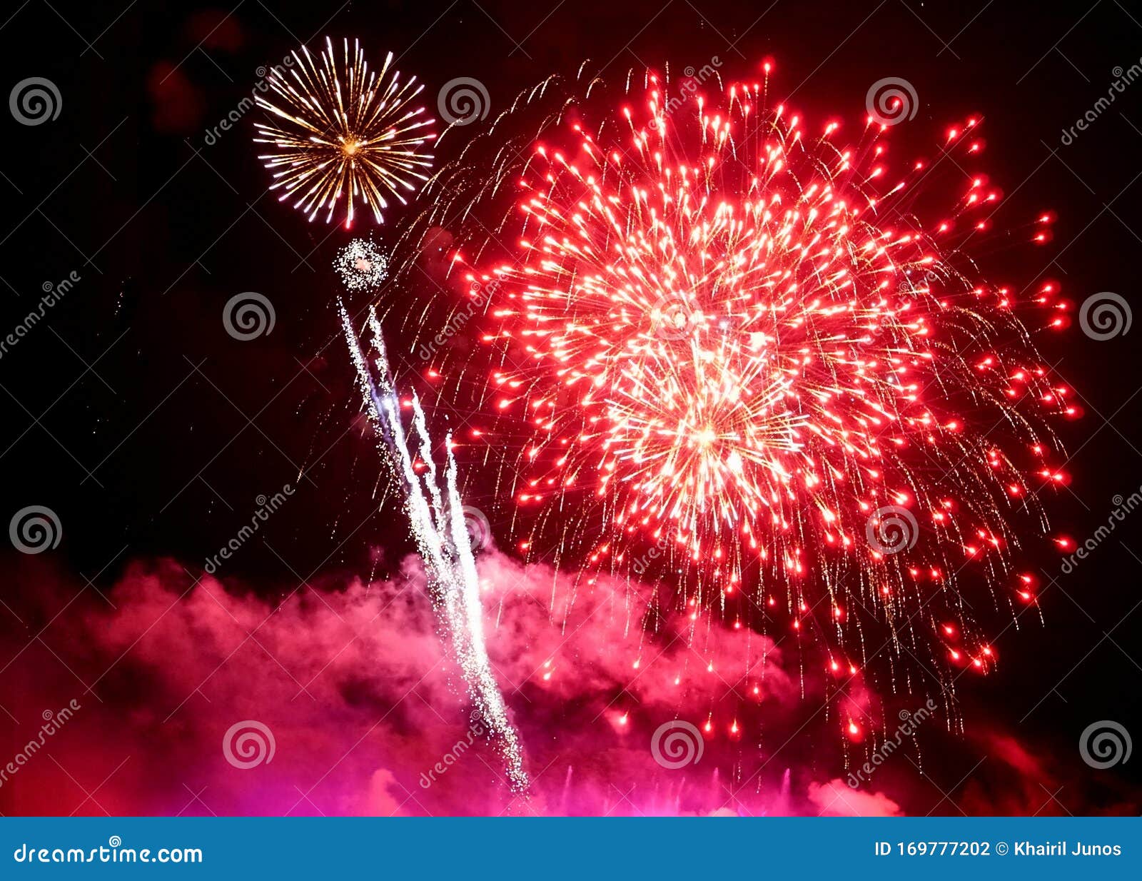 Stunning Red Fireworks Balls Exploding on the Sky at Night Stock Photo ...