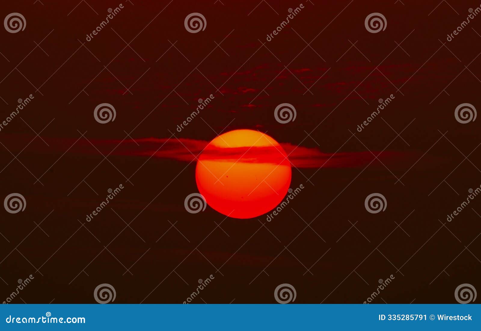 Stunning Red Full Moon at Sunset with a Cloud Creating the Illusion of ...