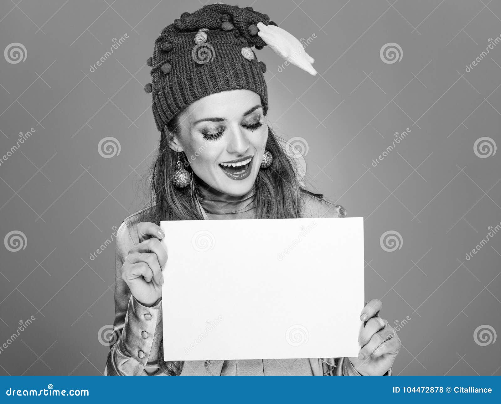 Smiling Elegant Woman on Grey Looking at Blank Paper Stock Photo ... Smiling Elegant Woman on Grey Looking at Blank Paper Stock Photo ...