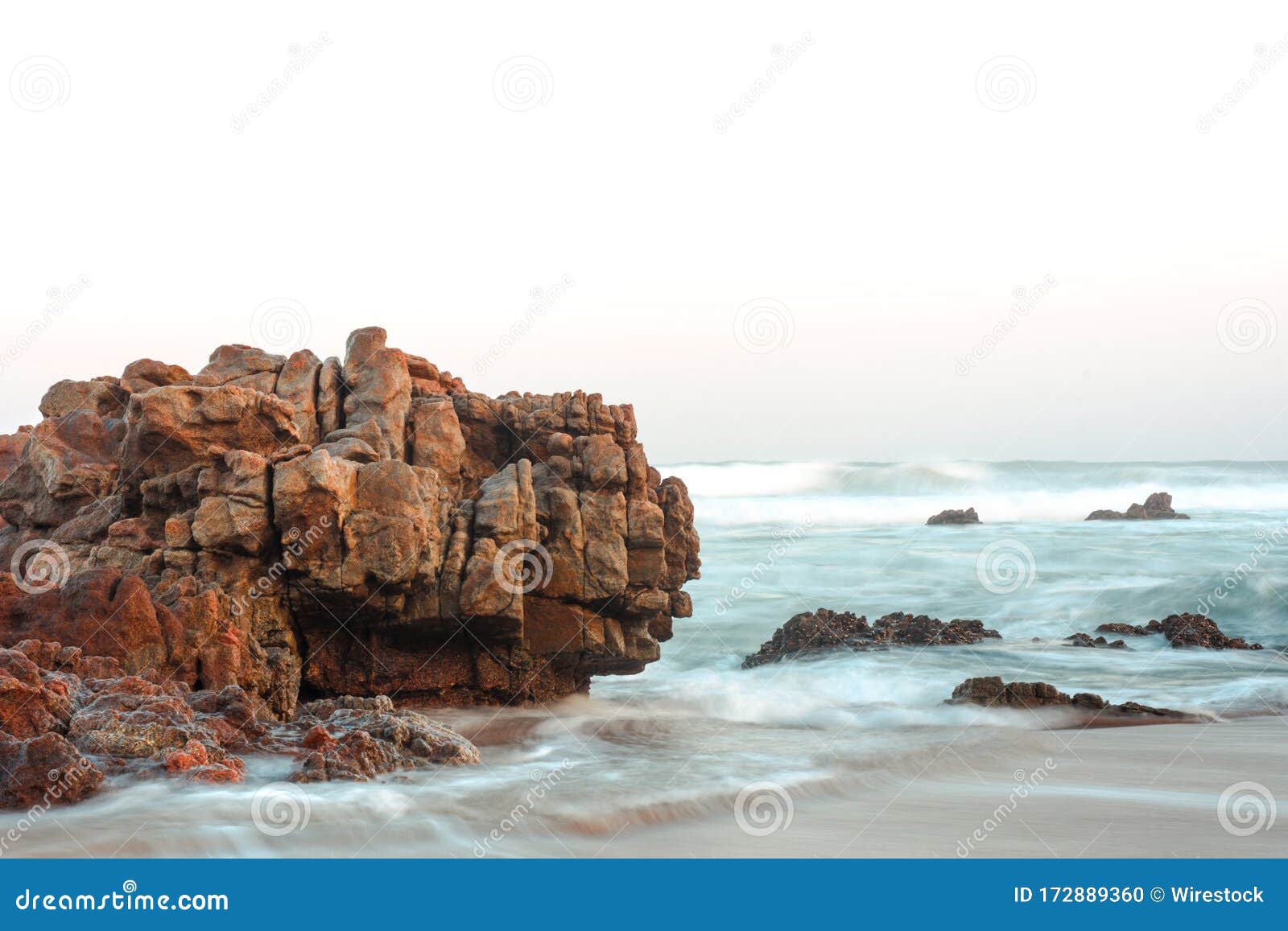 Stunning Shot of a Beach with Rock Formations by the Shore on a Bright ...