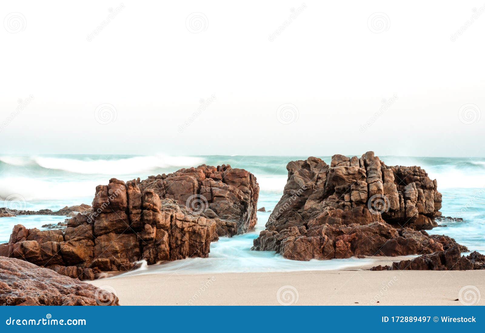 Stunning Shot of a Beach with Rock Formations by the Shore on a Bright ...