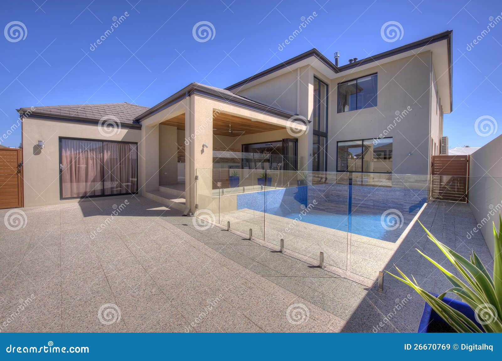 Two Storey Home Facade With Stone Brick Wall And Glass Paned Gray Front ...