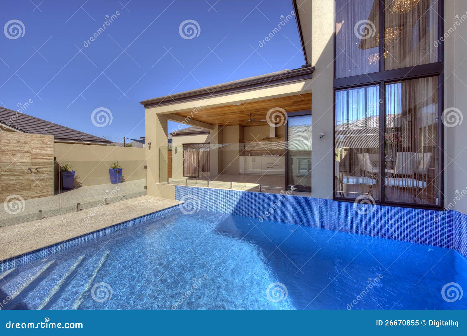 Two Storey Home Facade With Stone Brick Wall And Glass Paned Gray Front ...