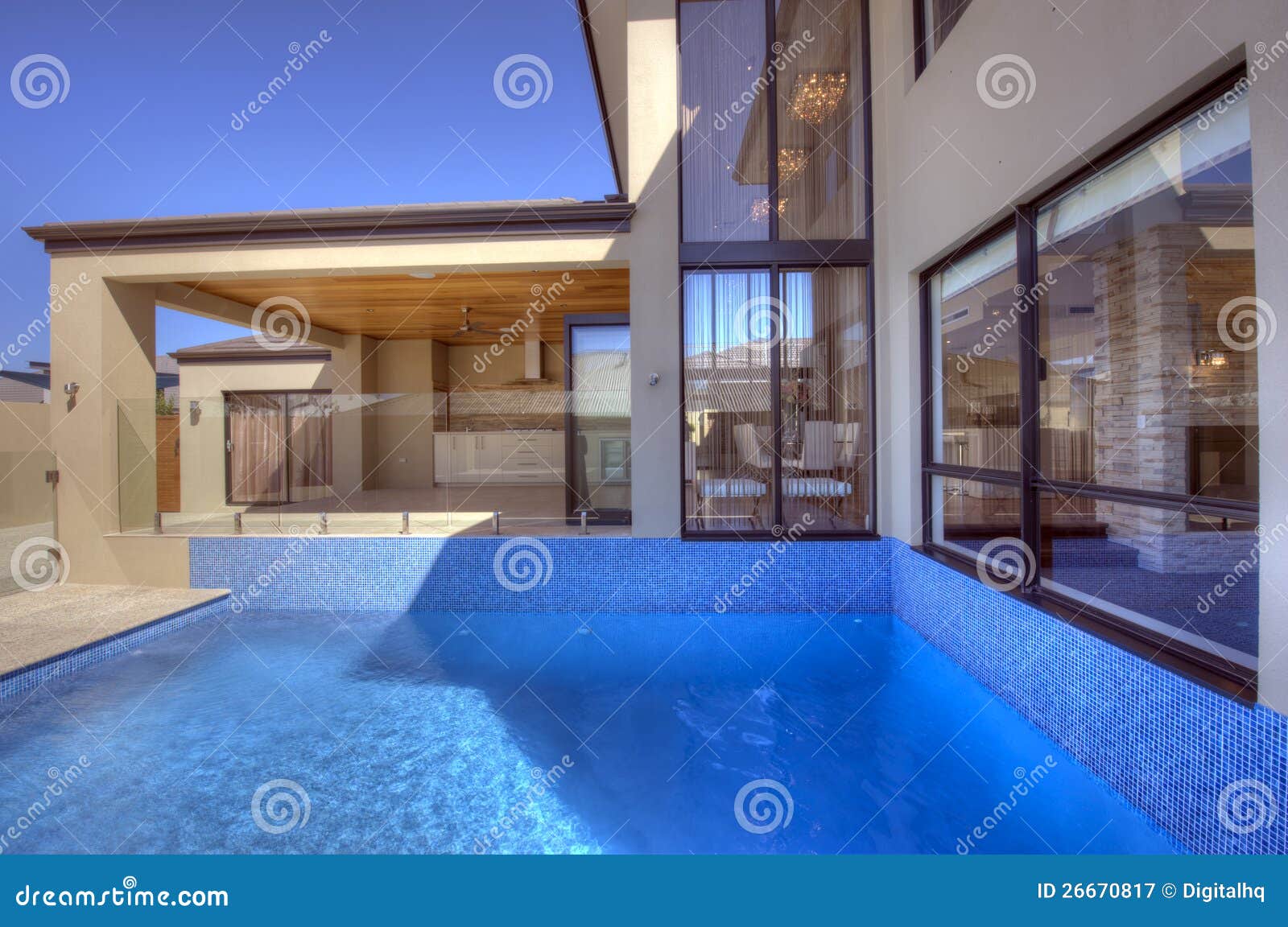 Two Storey Home Facade With Stone Brick Wall And Glass Paned Gray Front ...