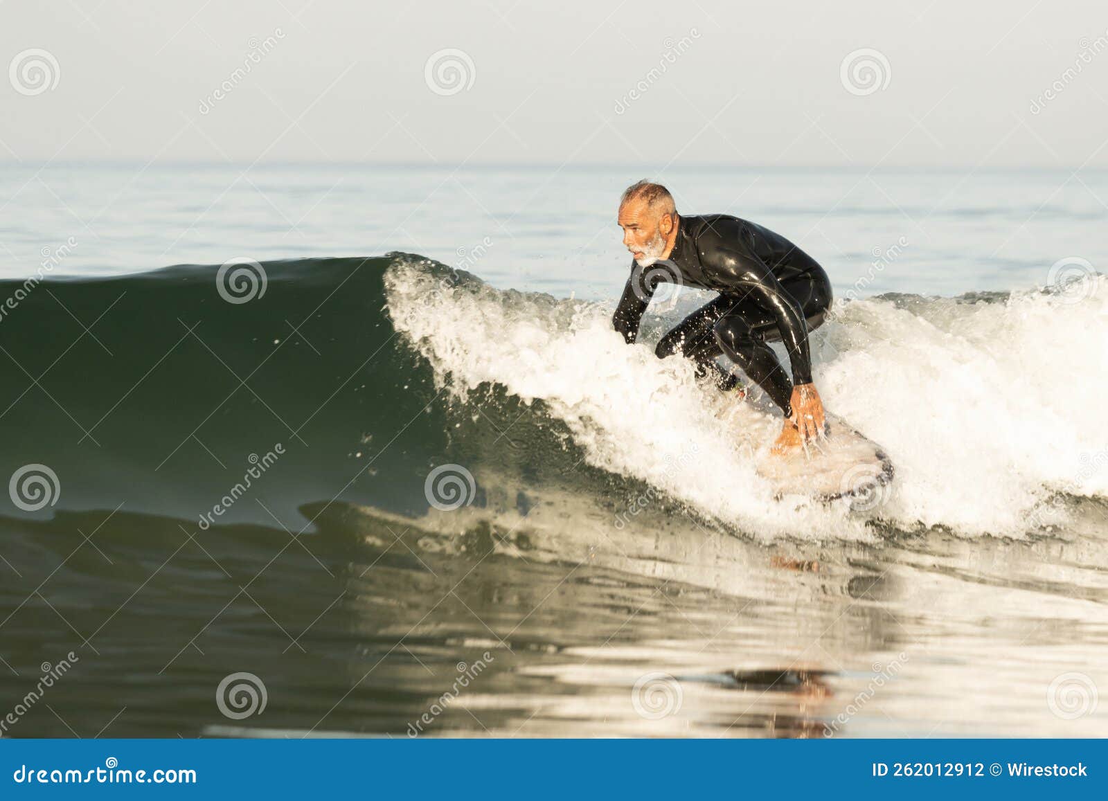 Stunning View of a Mature Surfer Catches a Wave Stock Photo - Image of ...