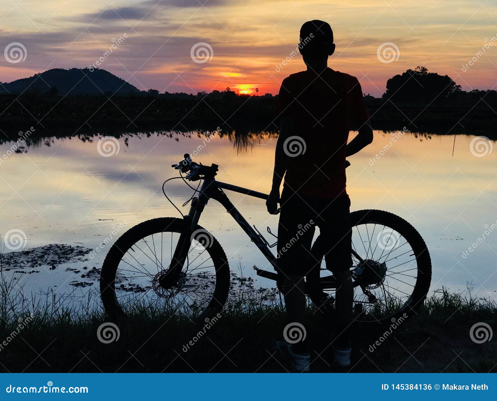 The Sunset View with Cyclist Stock Photo - Image of sunset, cyclist ...