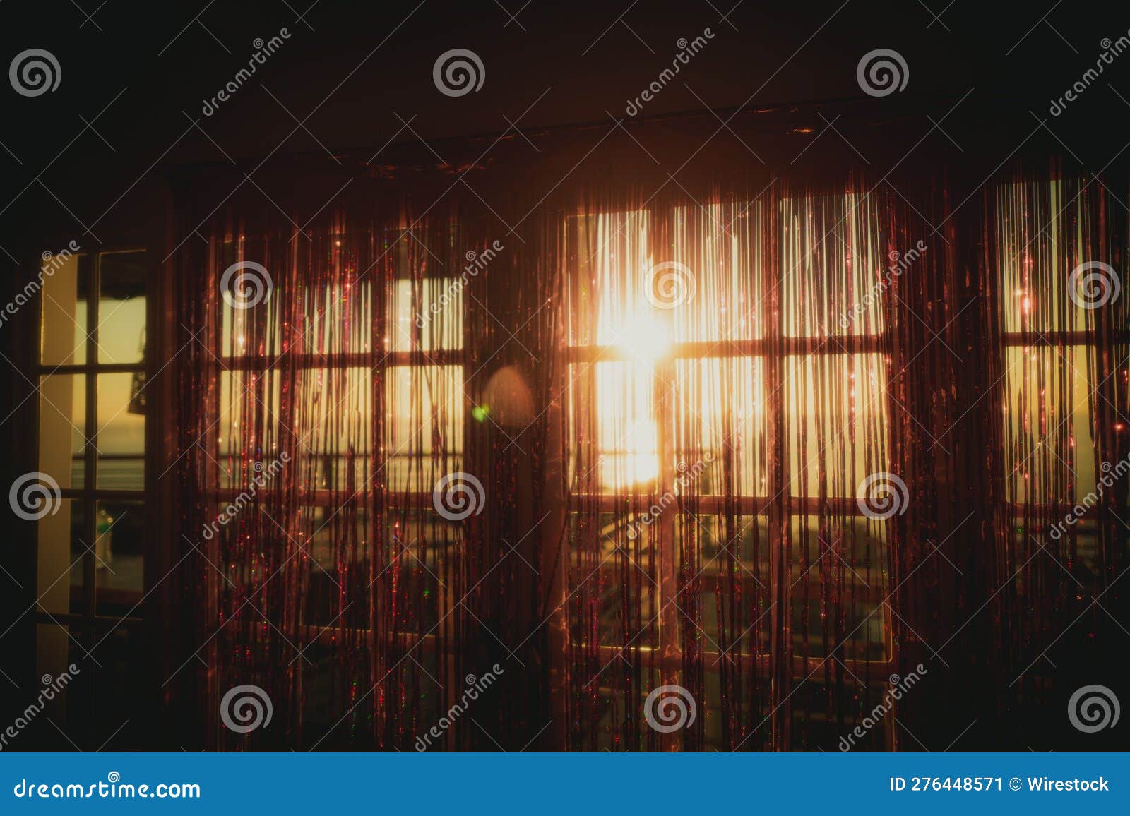 Stunning View of a Window with Sheer White Curtains and the Sun Setting ...