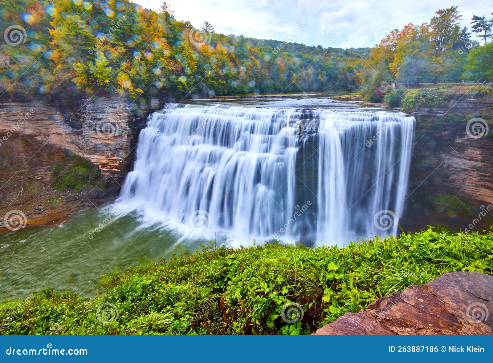 Stunning Waterfall Pouring Over Cliffs with Drops Splashing on Lens and ...