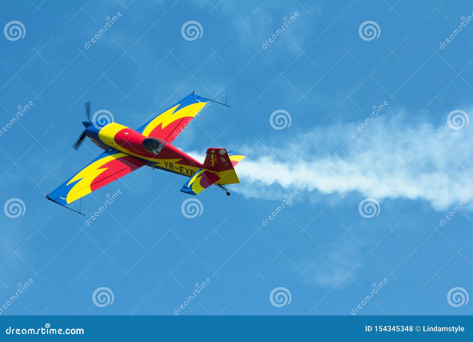 Stunt Plane Flying Against Clear Blue Sky. Editorial Stock Photo ...